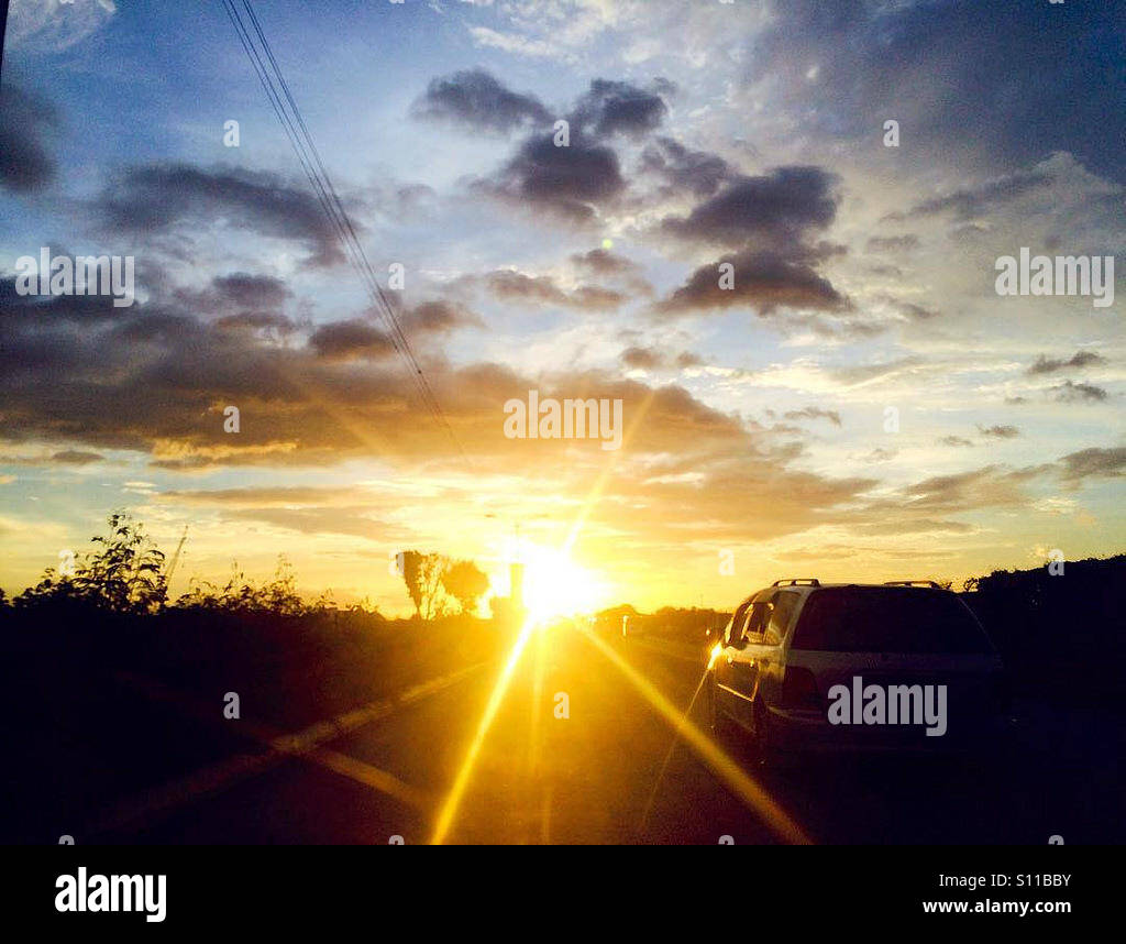 Capturing sunset at the road Stock Photo - Alamy