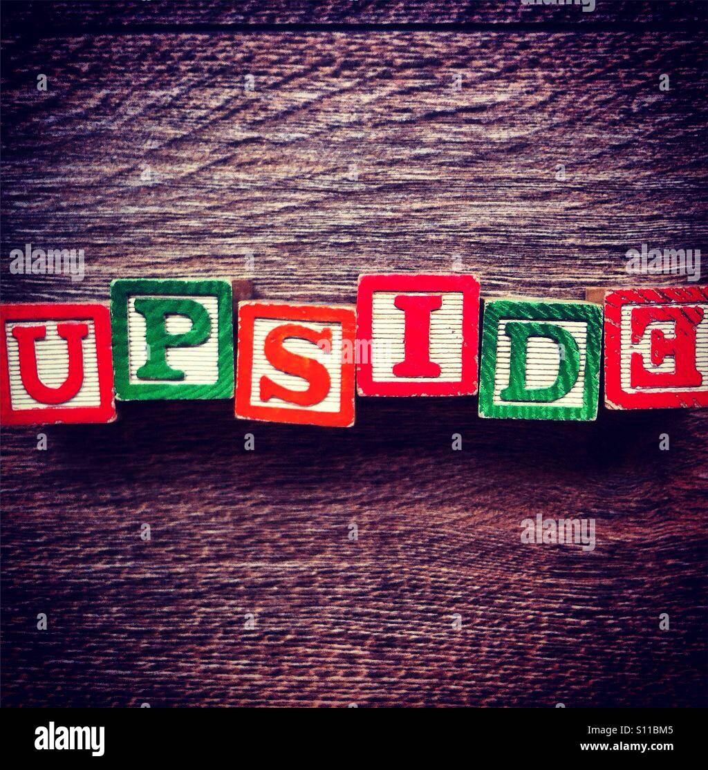 Word UPSIDE done with alphabet wood blocks letters Stock Photo - Alamy