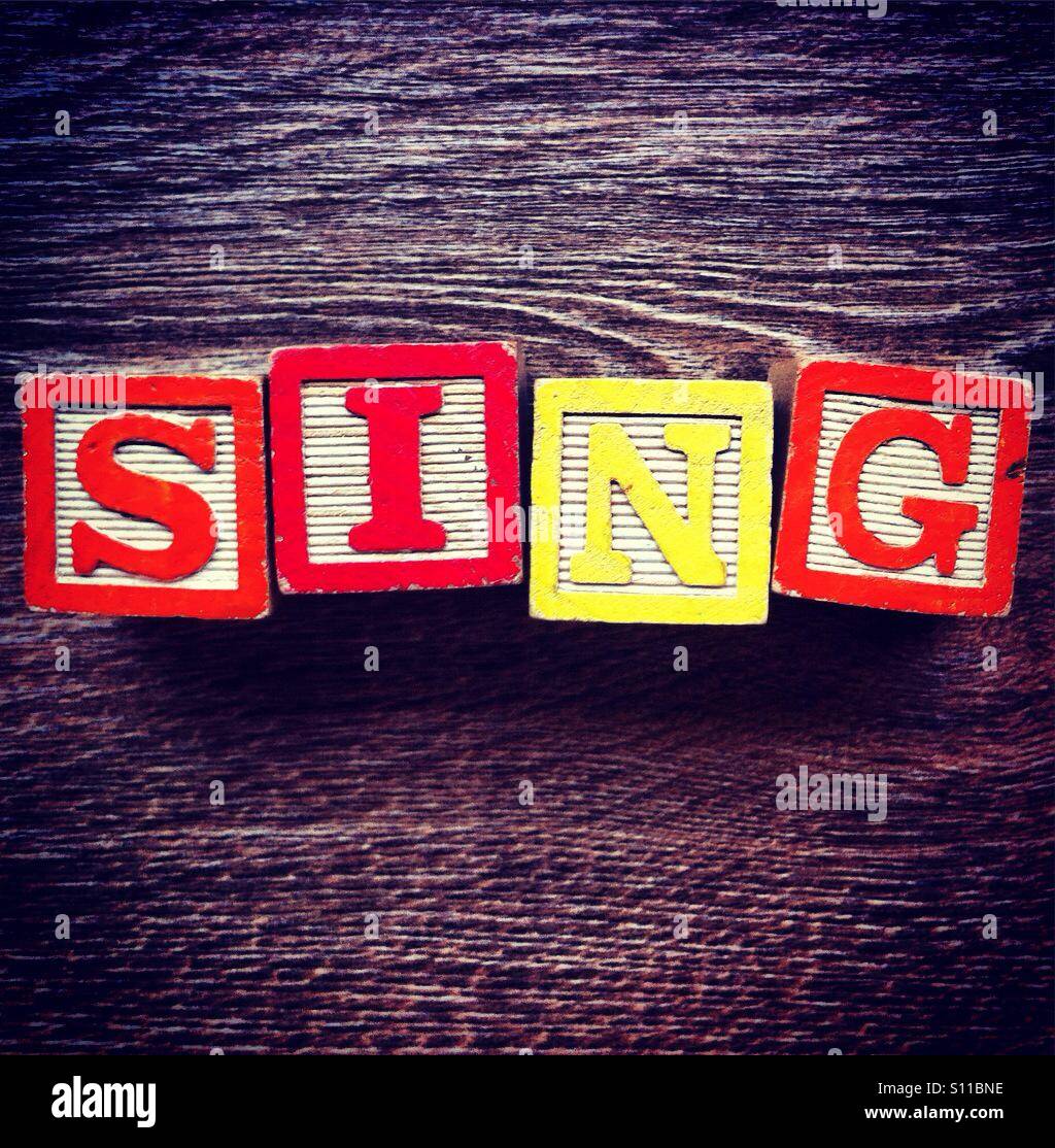 Word SING done with alphabet wood blocks letters Stock Photo - Alamy