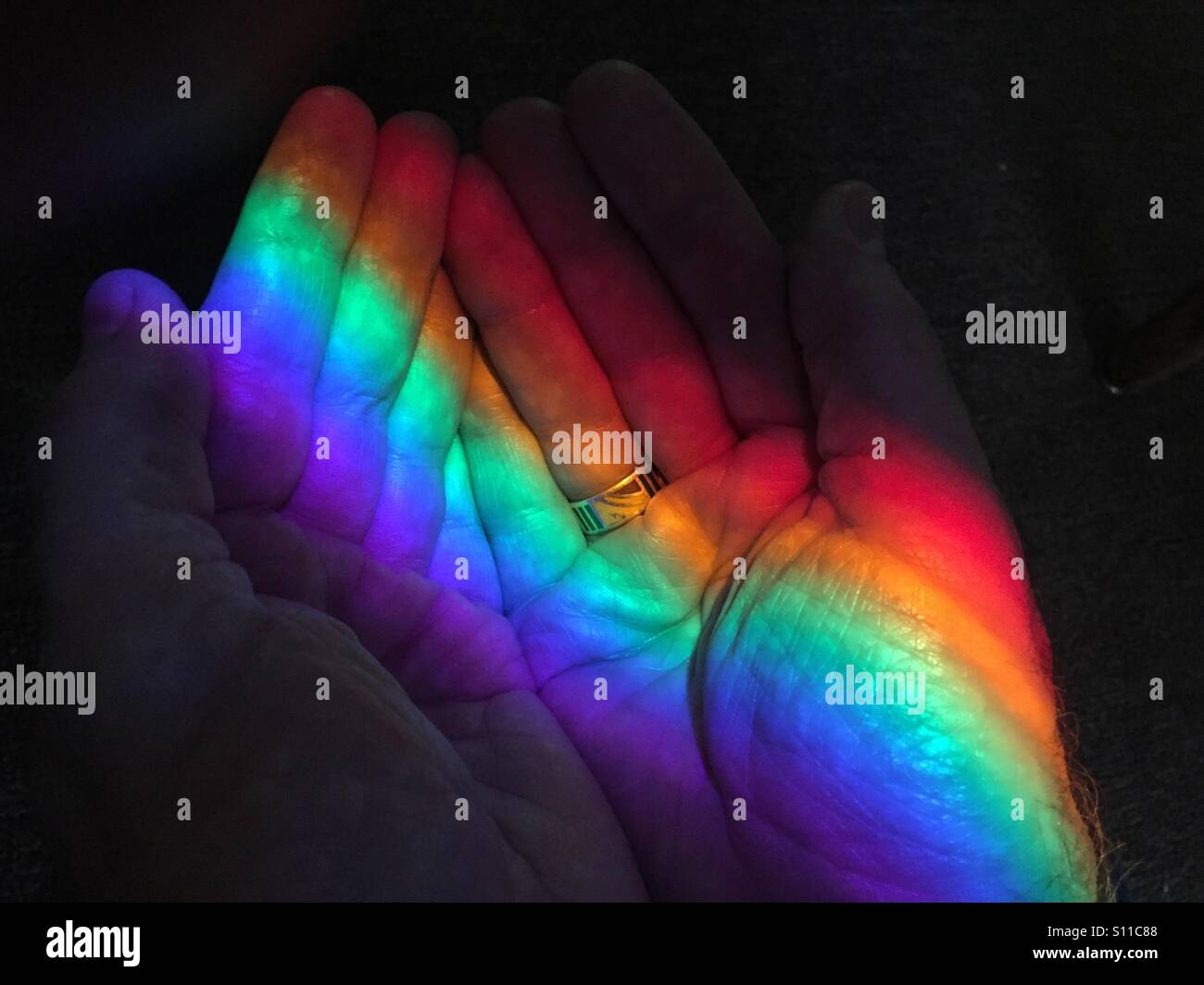 Rainbow hands hi-res stock photography and images - Alamy
