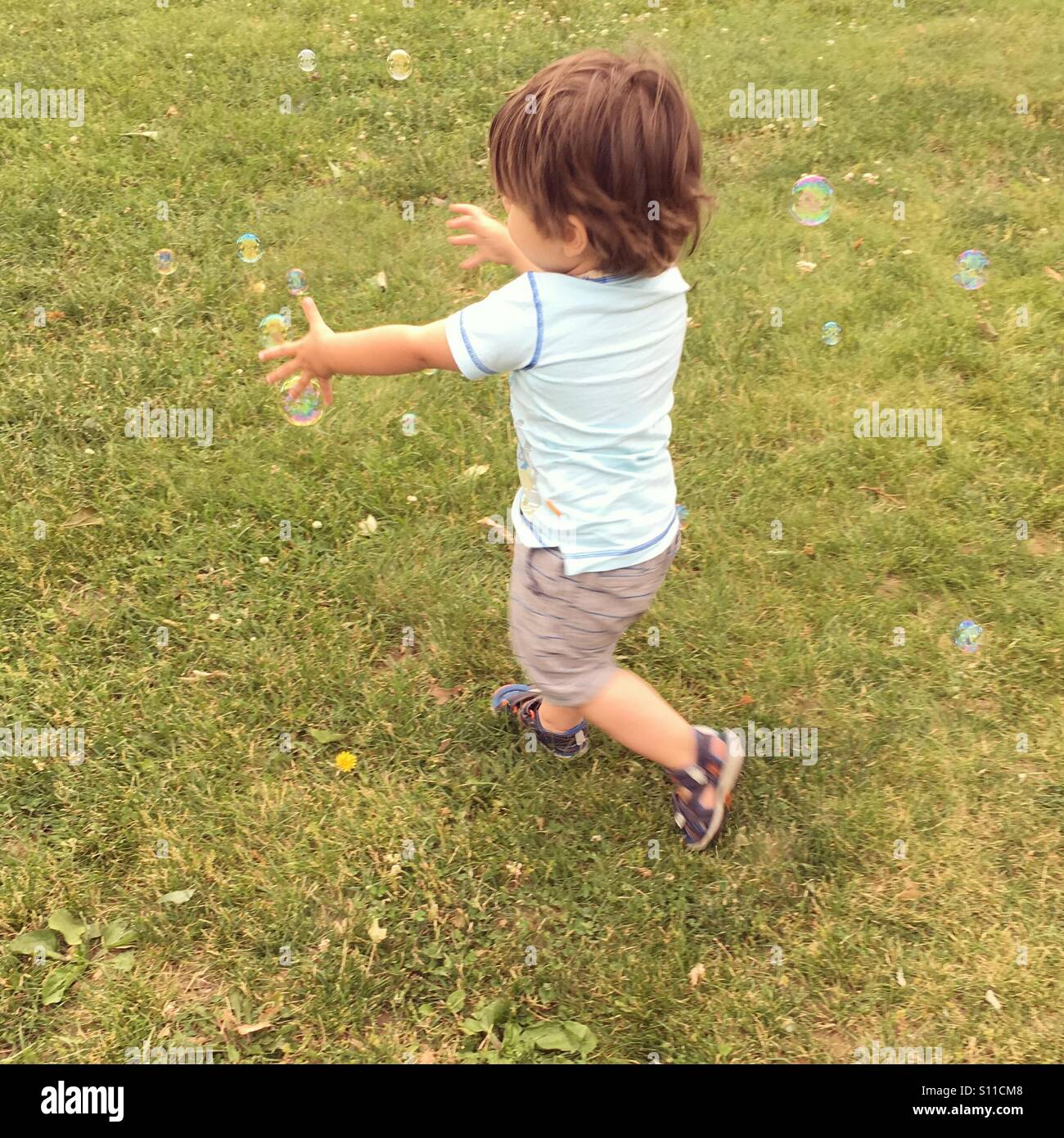 Child chasing hi-res stock photography and images - Alamy