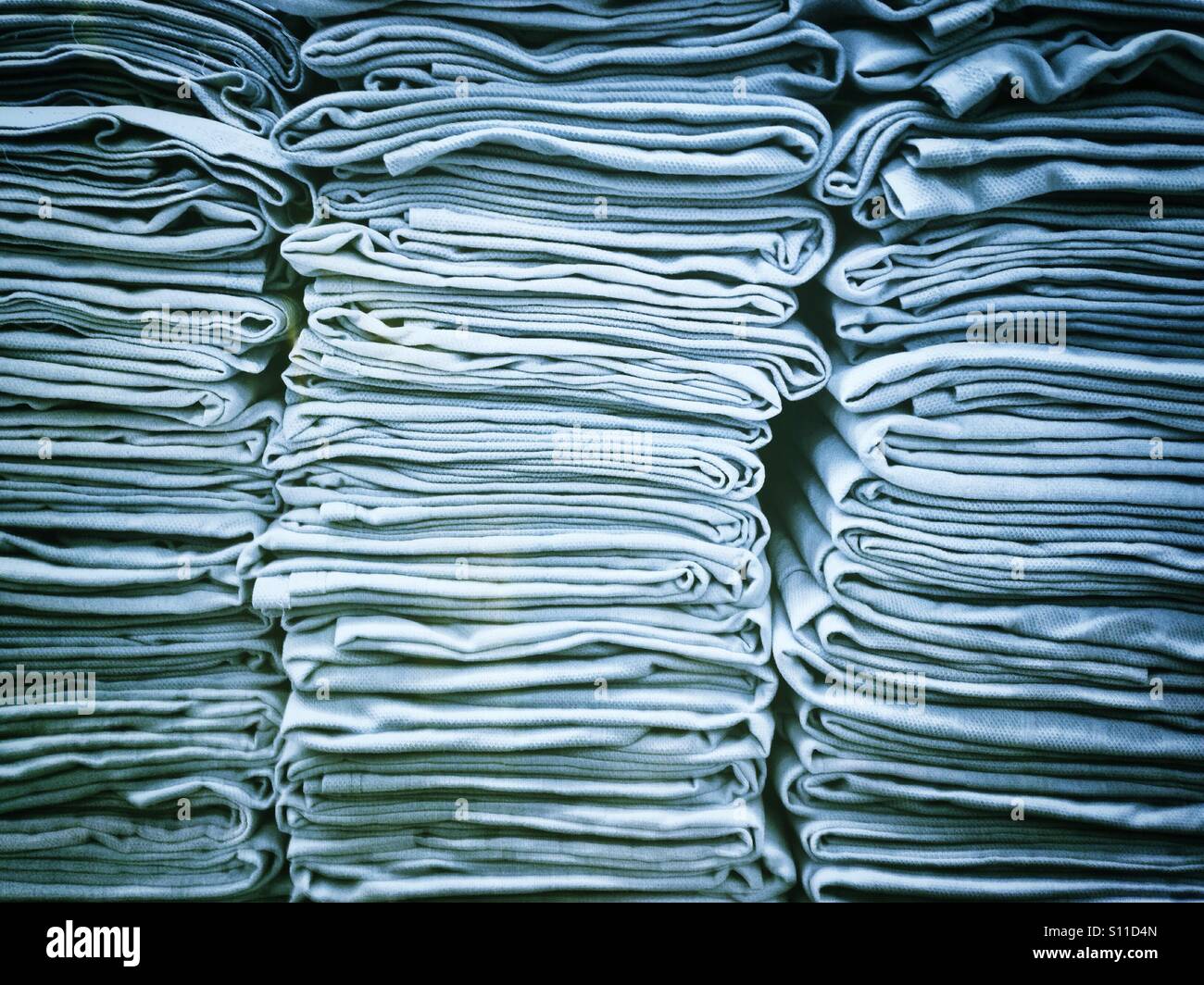 Piles of linens Stock Photo - Alamy
