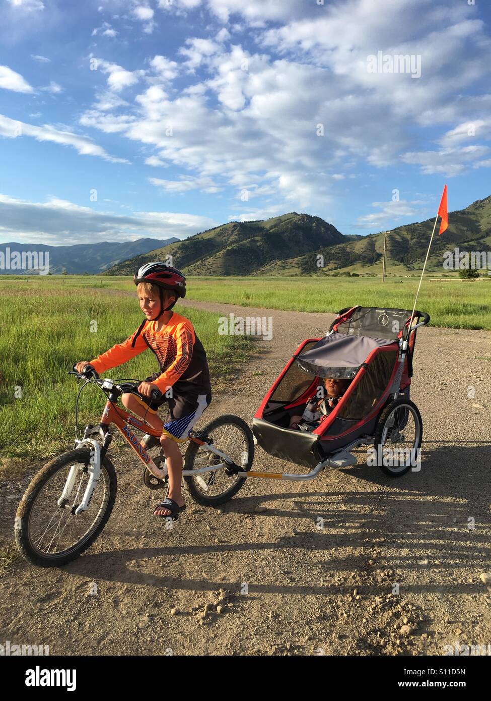 Kids on a Bike Ride Stock Photo - Alamy
