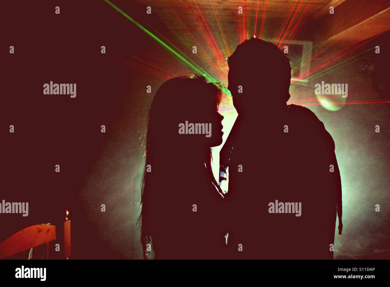 An action shot of the connection between two people walking passed one ...