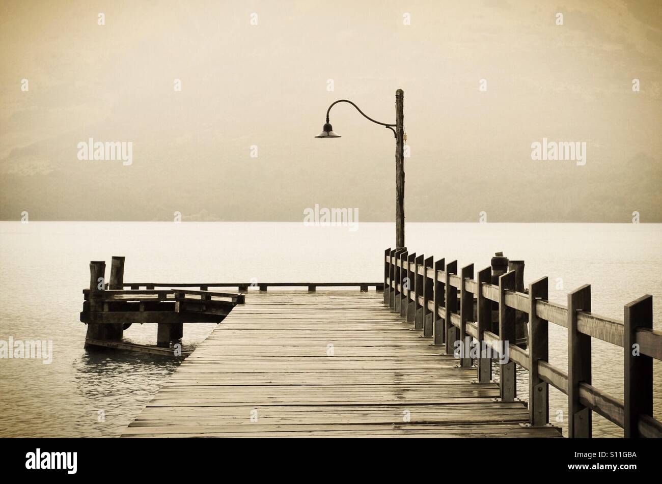 Empty dock at the lake Stock Photo - Alamy