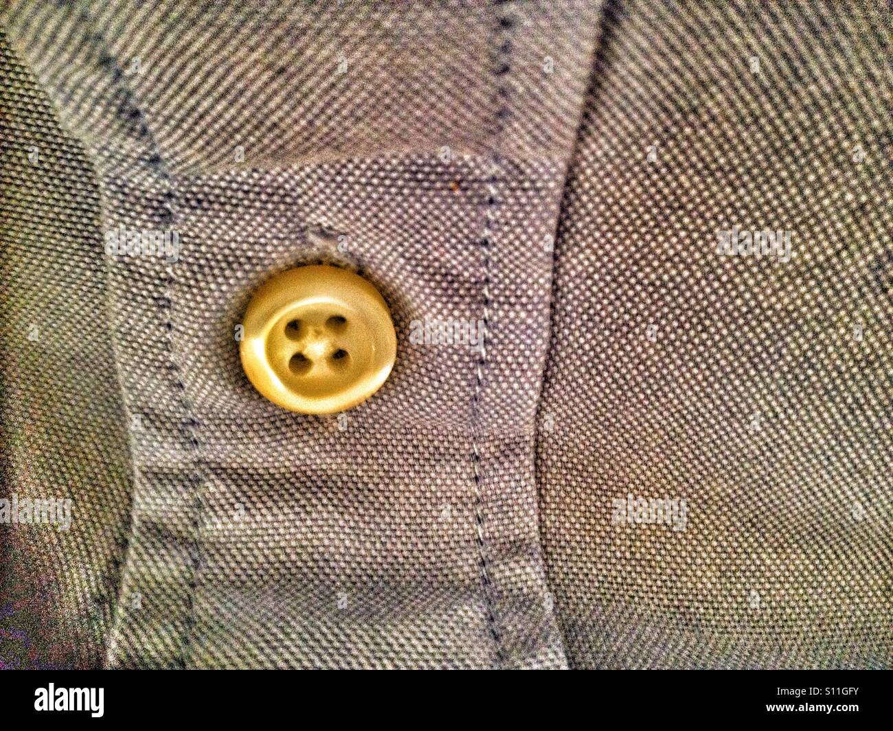 A button on a shirt Stock Photo - Alamy