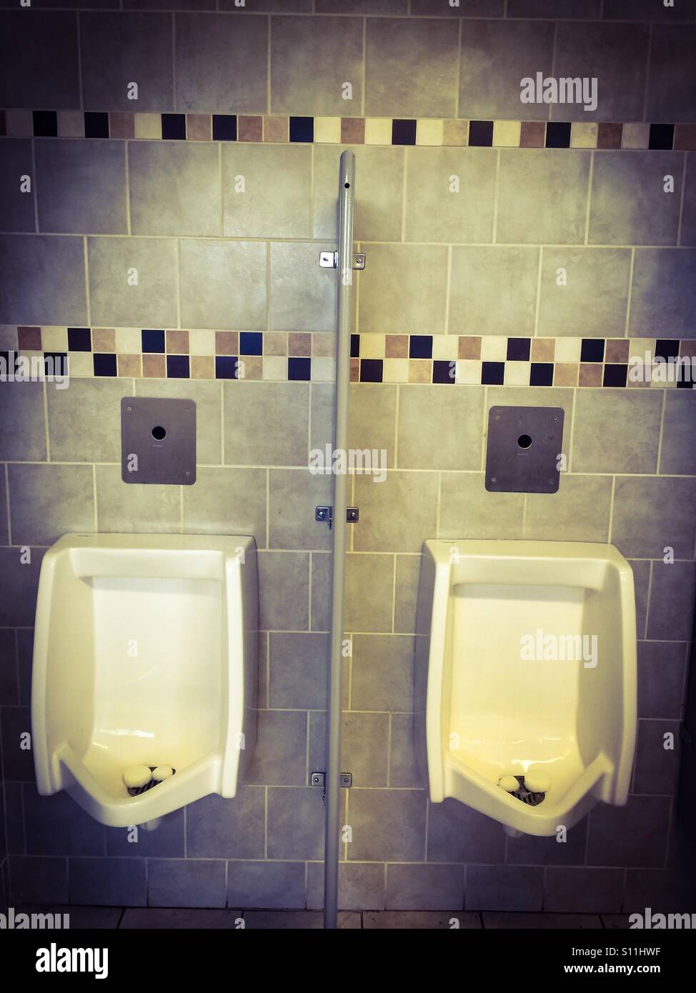 Two urinals hi-res stock photography and images - Alamy