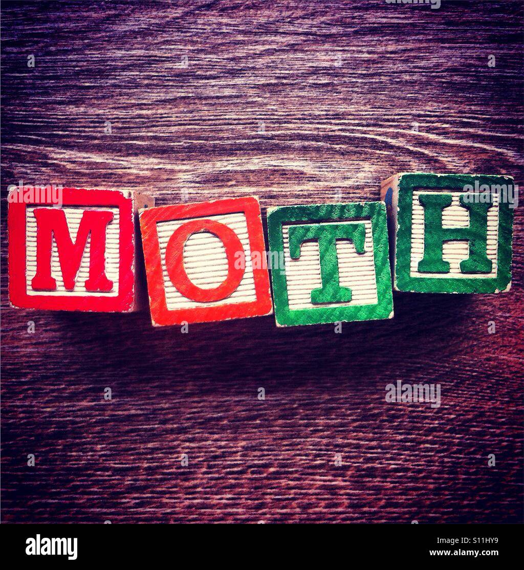 Word MOTH fone with alphabet wood block letters Stock Photo - Alamy