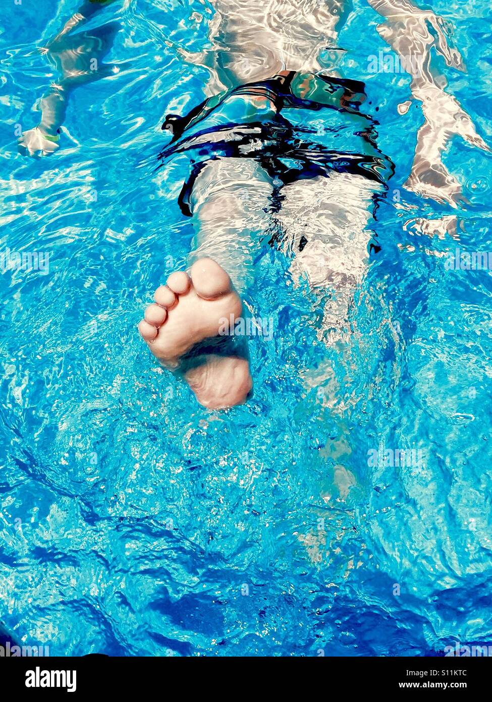 Floating on her back hi-res stock photography and images - Alamy