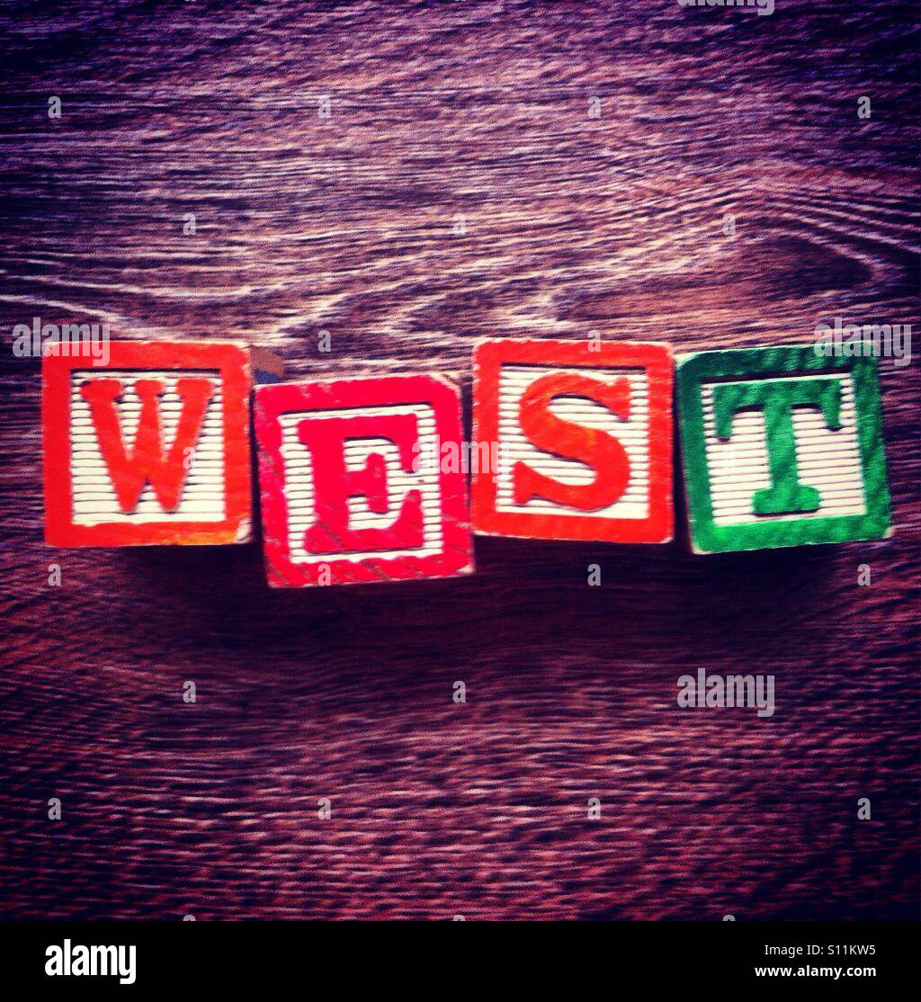 Word WEST done with alphabet wood blocks letters Stock Photo - Alamy