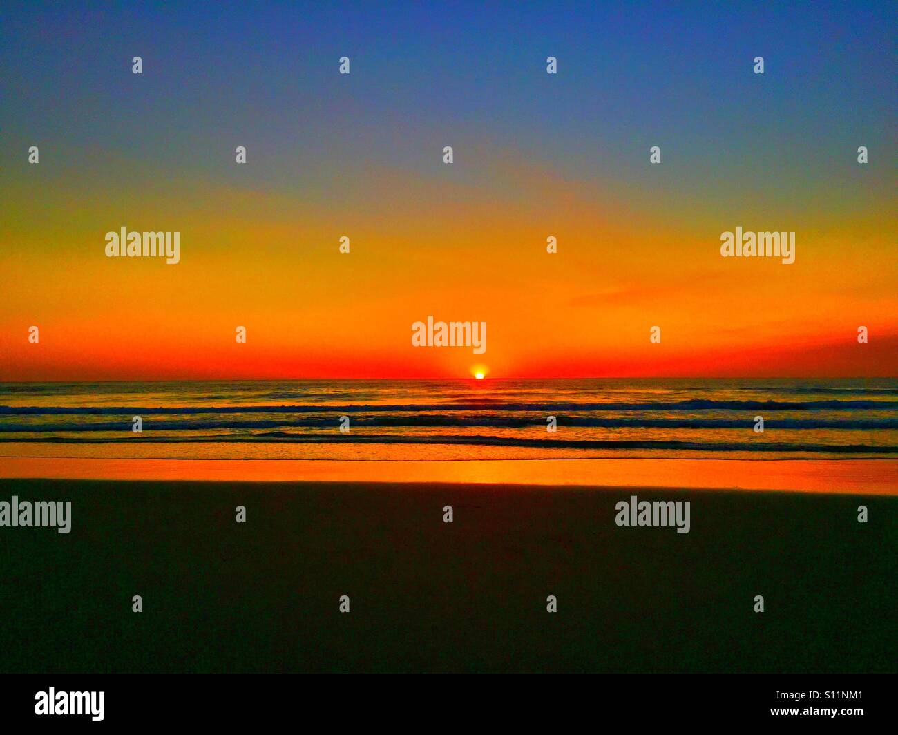 Bright sunrise by the sea Stock Photo - Alamy