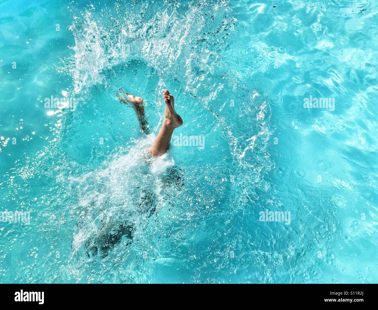 Child diving in a swimming pool Stock Photo - Alamy