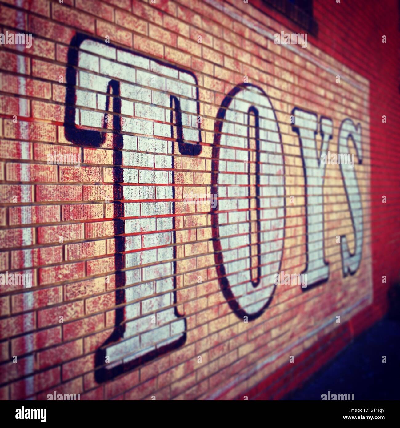 Painted brick TOYS sign on a toy store wall on Solano Avenue in ...