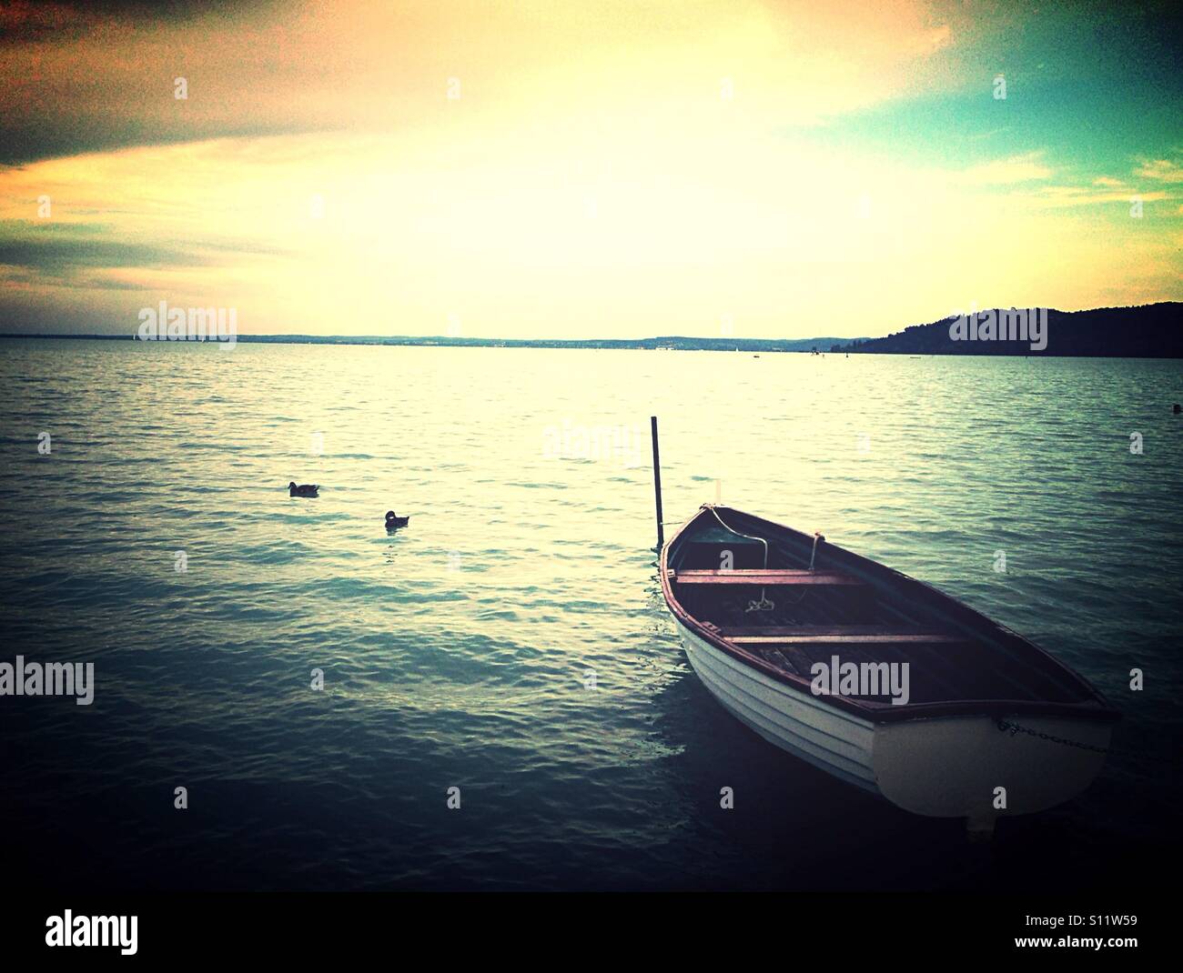 Sunset boat on lake hi-res stock photography and images - Alamy