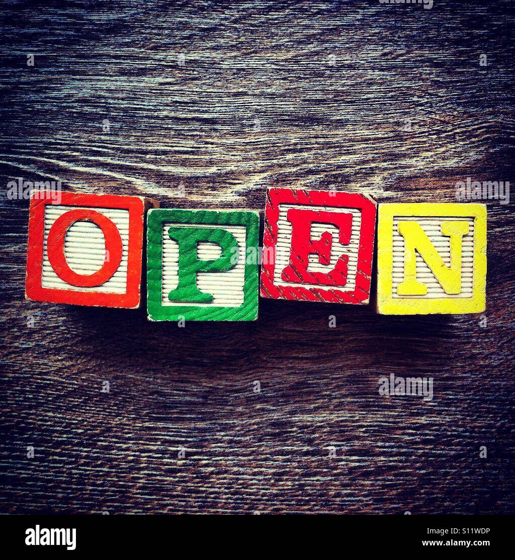 OPEN word done with wood blocks letters Stock Photo - Alamy