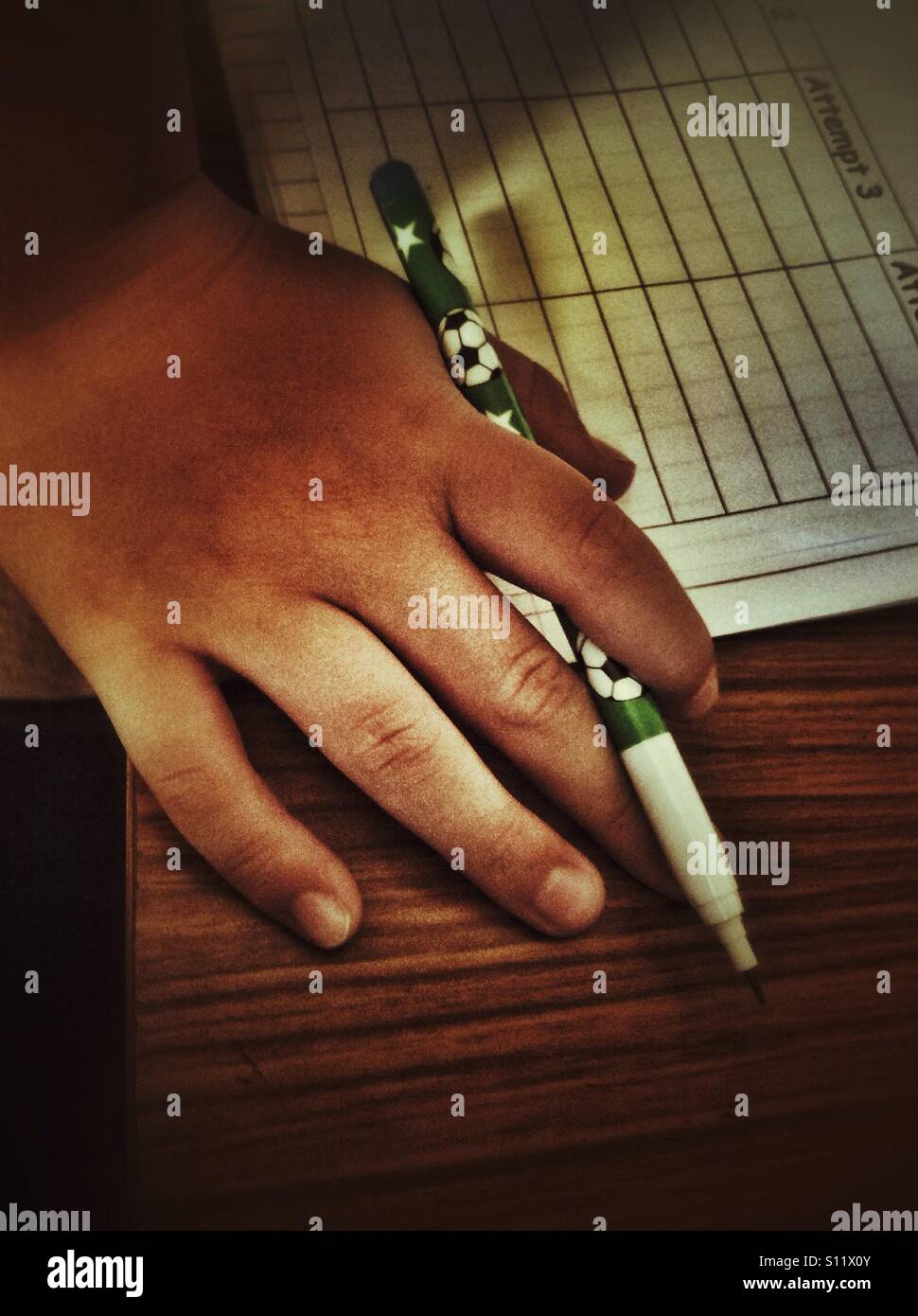 Childs hand holding pencil hi-res stock photography and images - Alamy