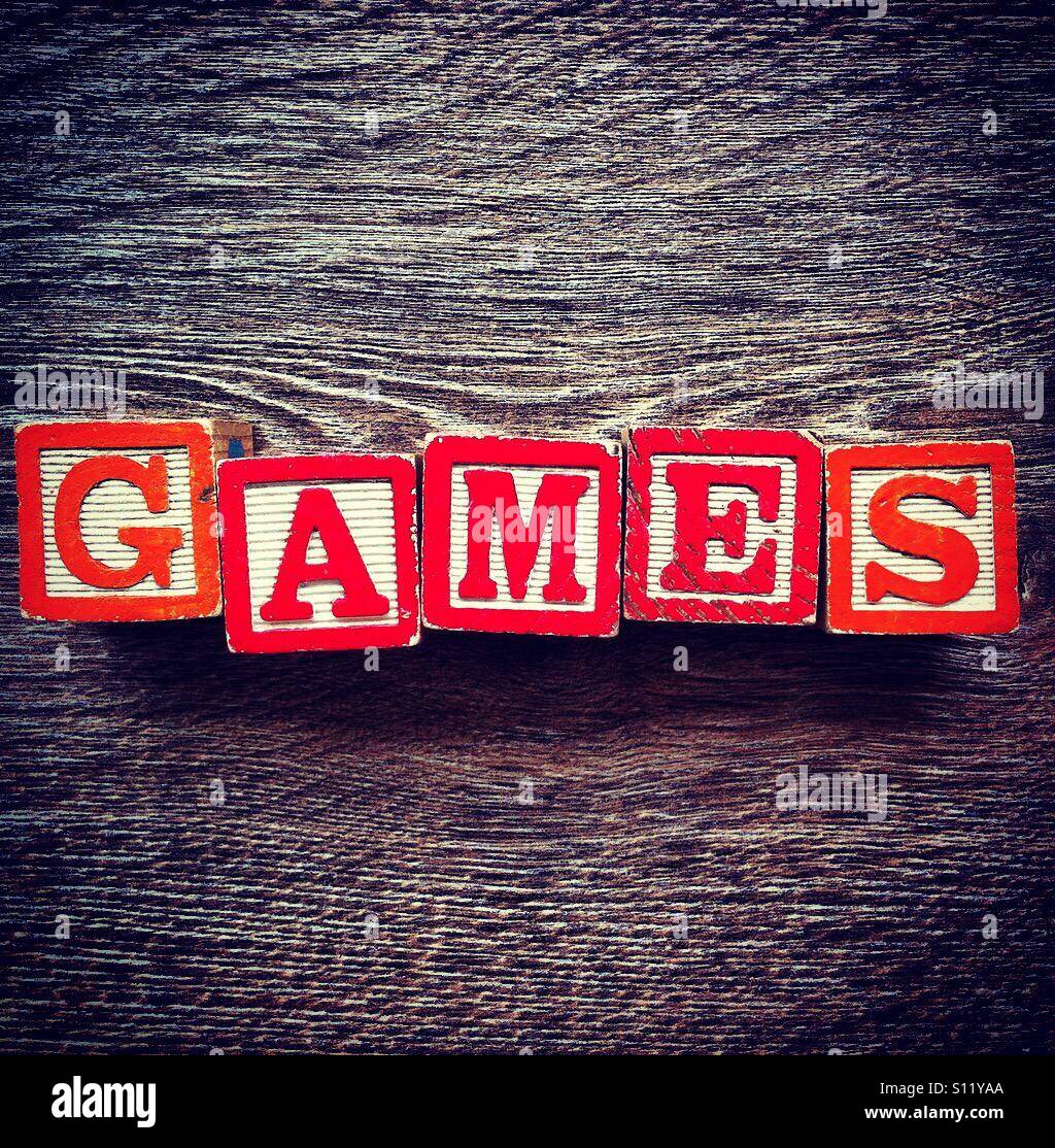 GAMES word done with alphabet wood blocks letters Stock Photo - Alamy