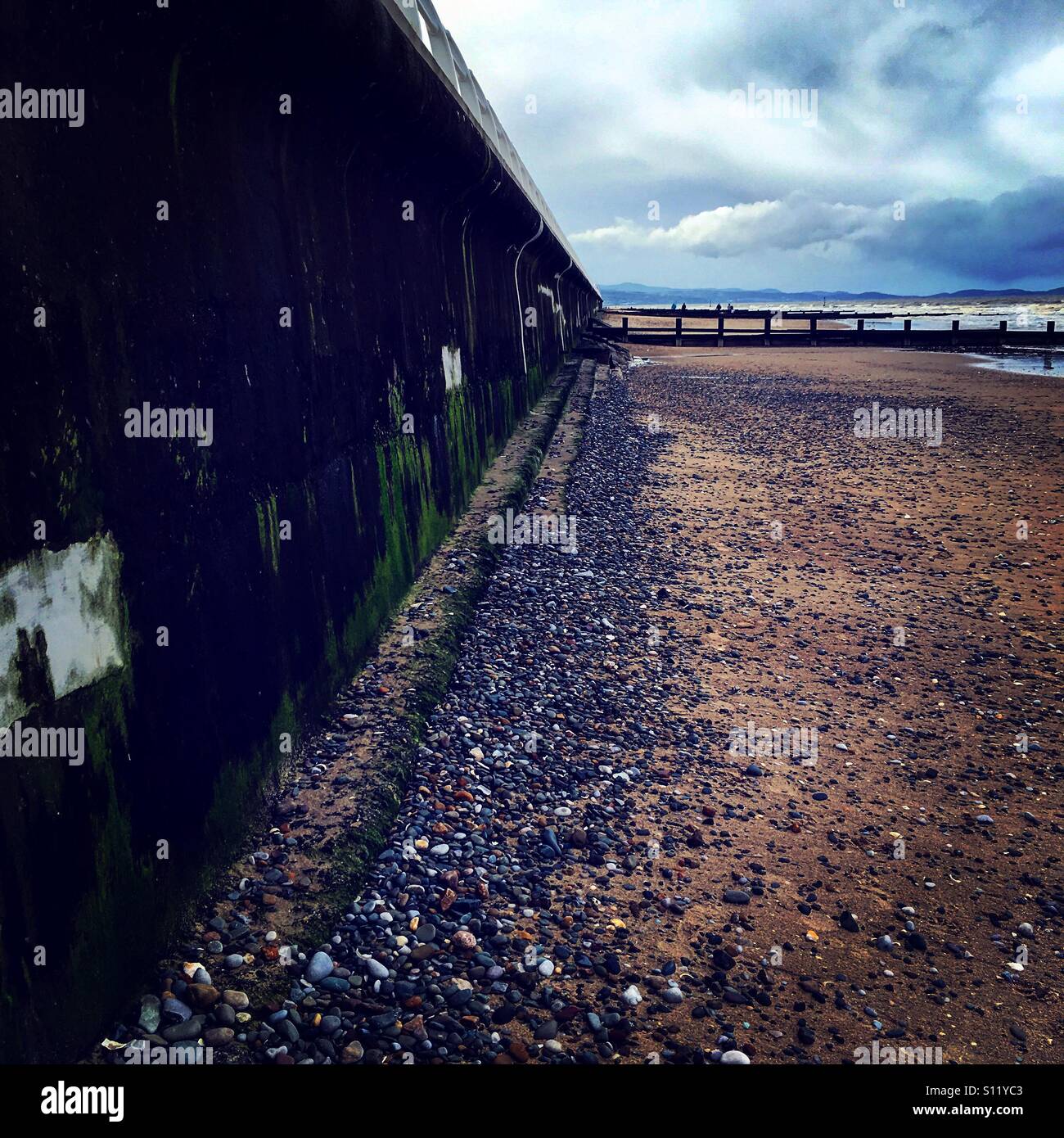 Sea wall on the beach front Stock Photo - Alamy