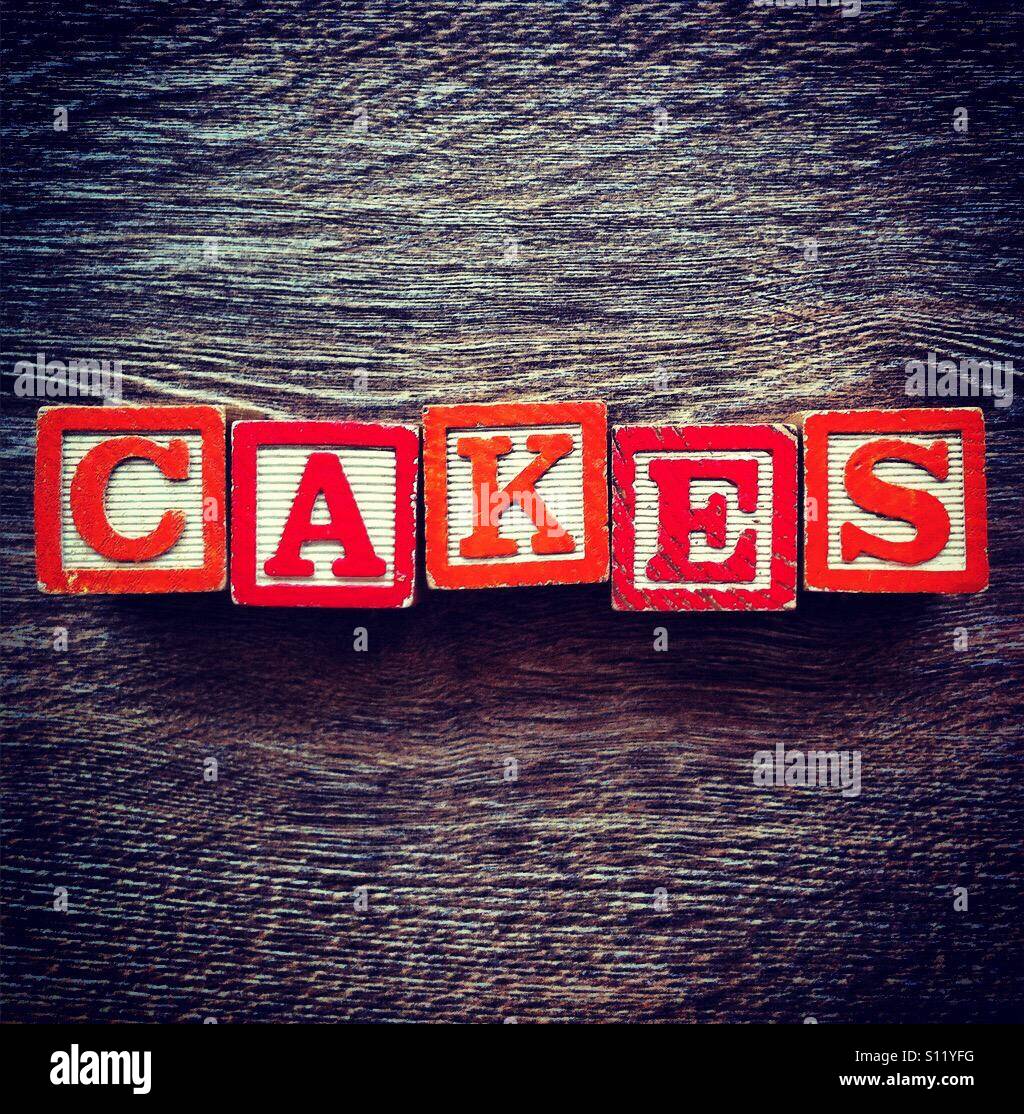 CAKES word done with alphabet wood blocks letters Stock Photo - Alamy