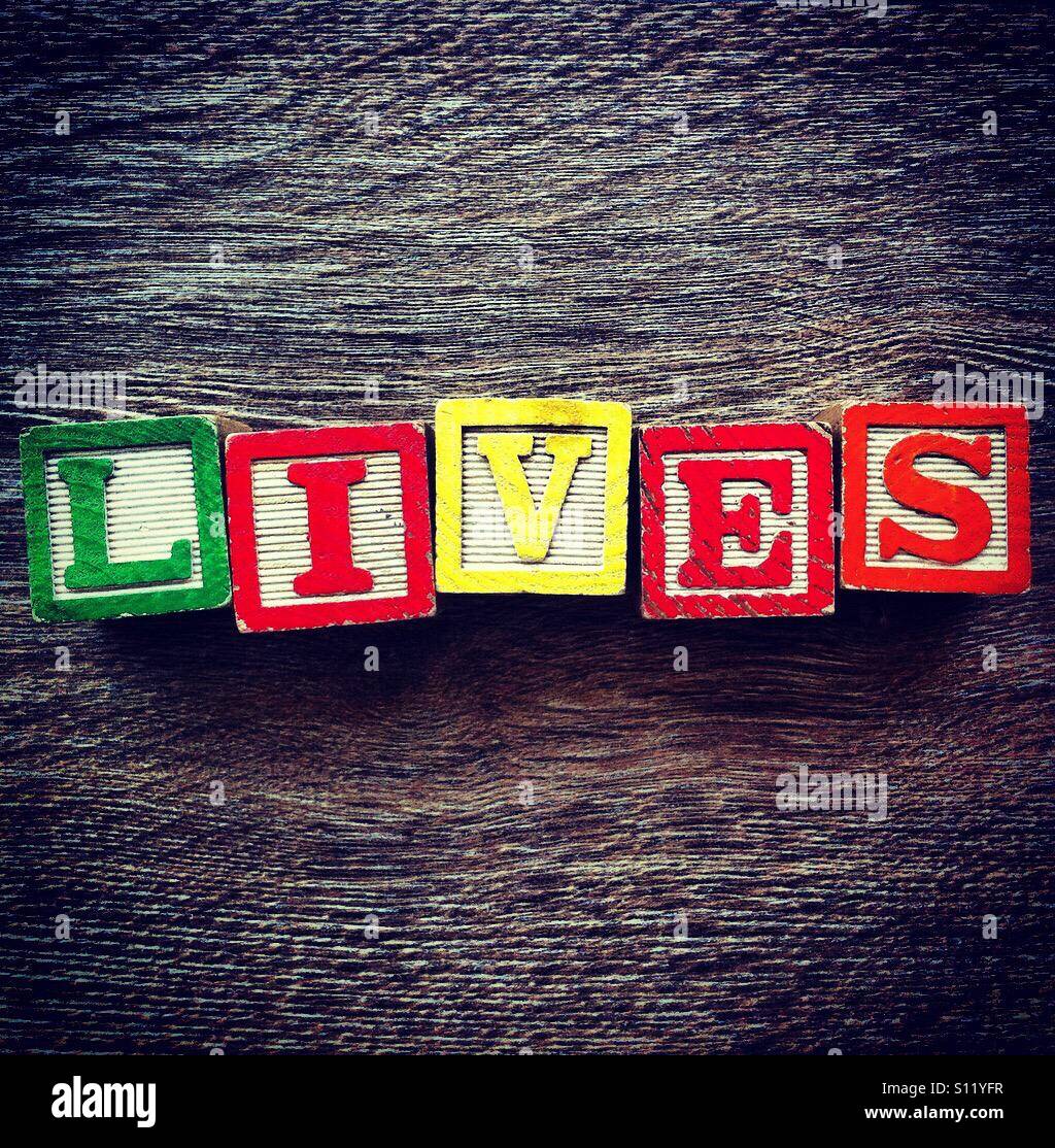 LIVES word done with alphabet wood blocks letters Stock Photo - Alamy