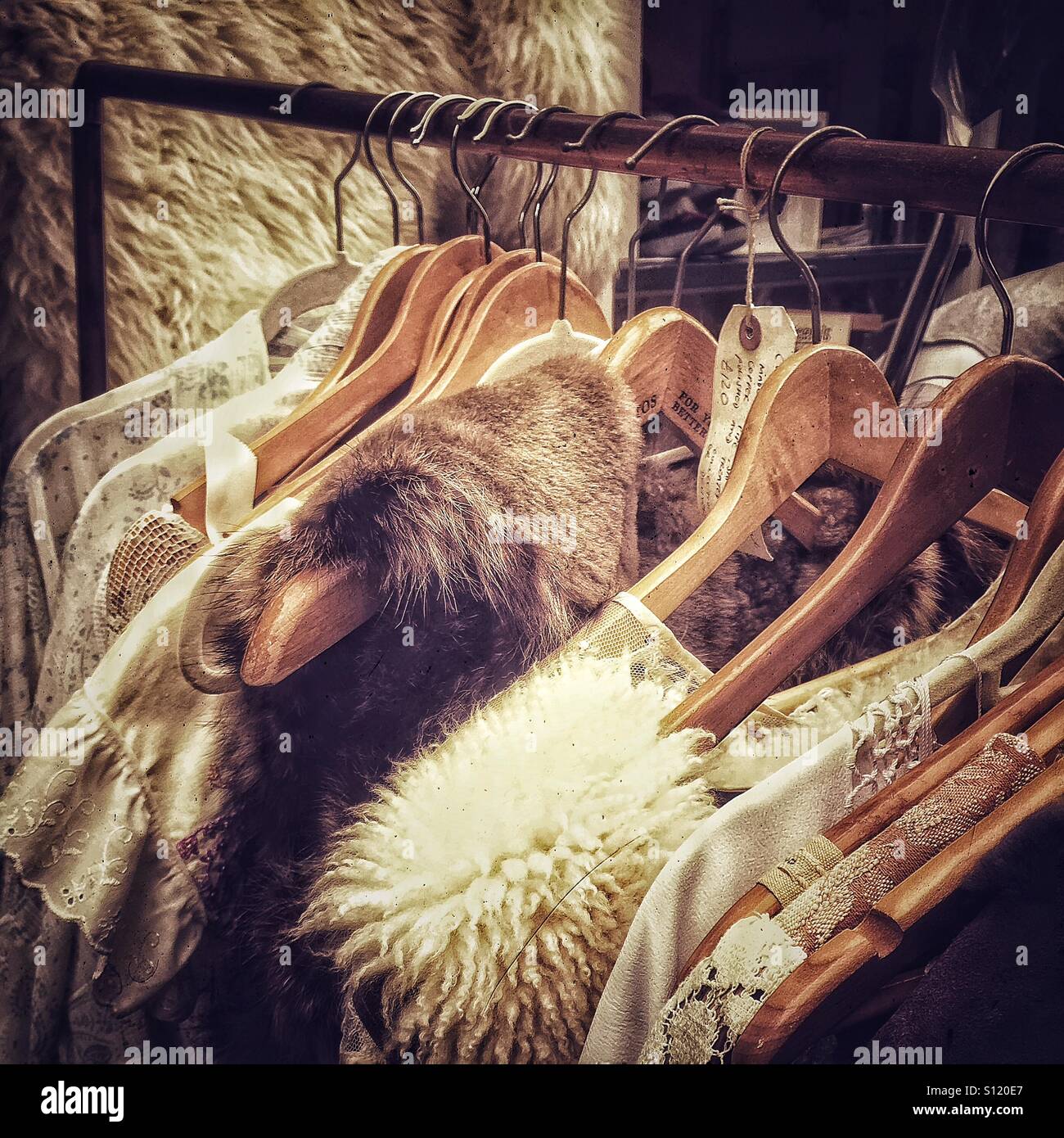 Vintage clothes on rail Stock Photo - Alamy