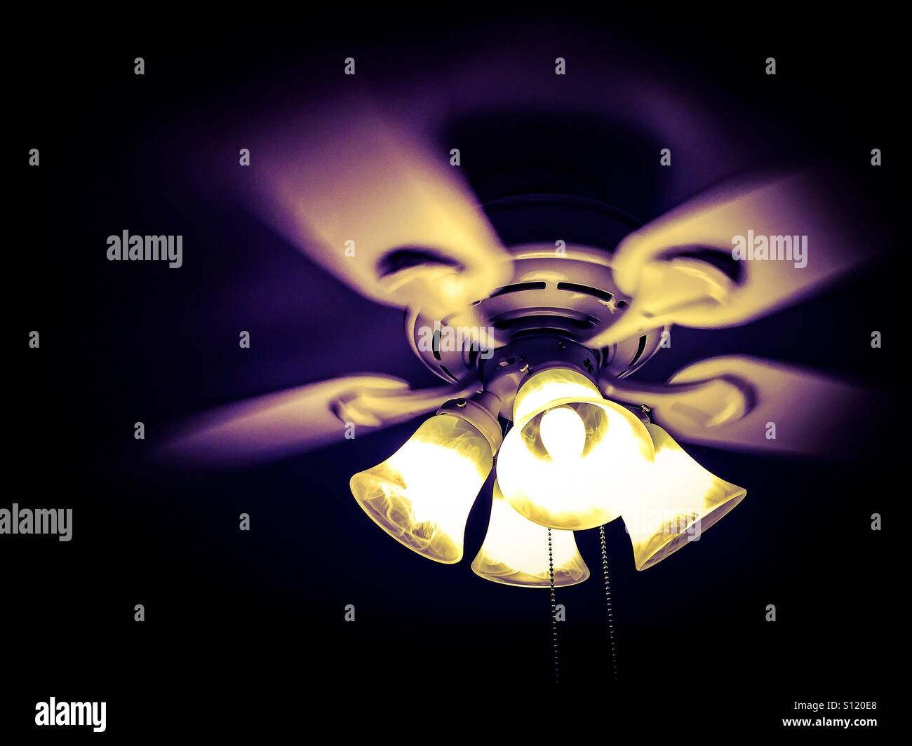 Lights and ceiling fan in motion Stock Photo - Alamy