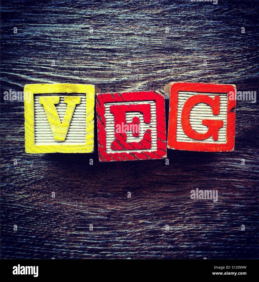 VEG word done with alphabet wood blocks letters Stock Photo - Alamy
