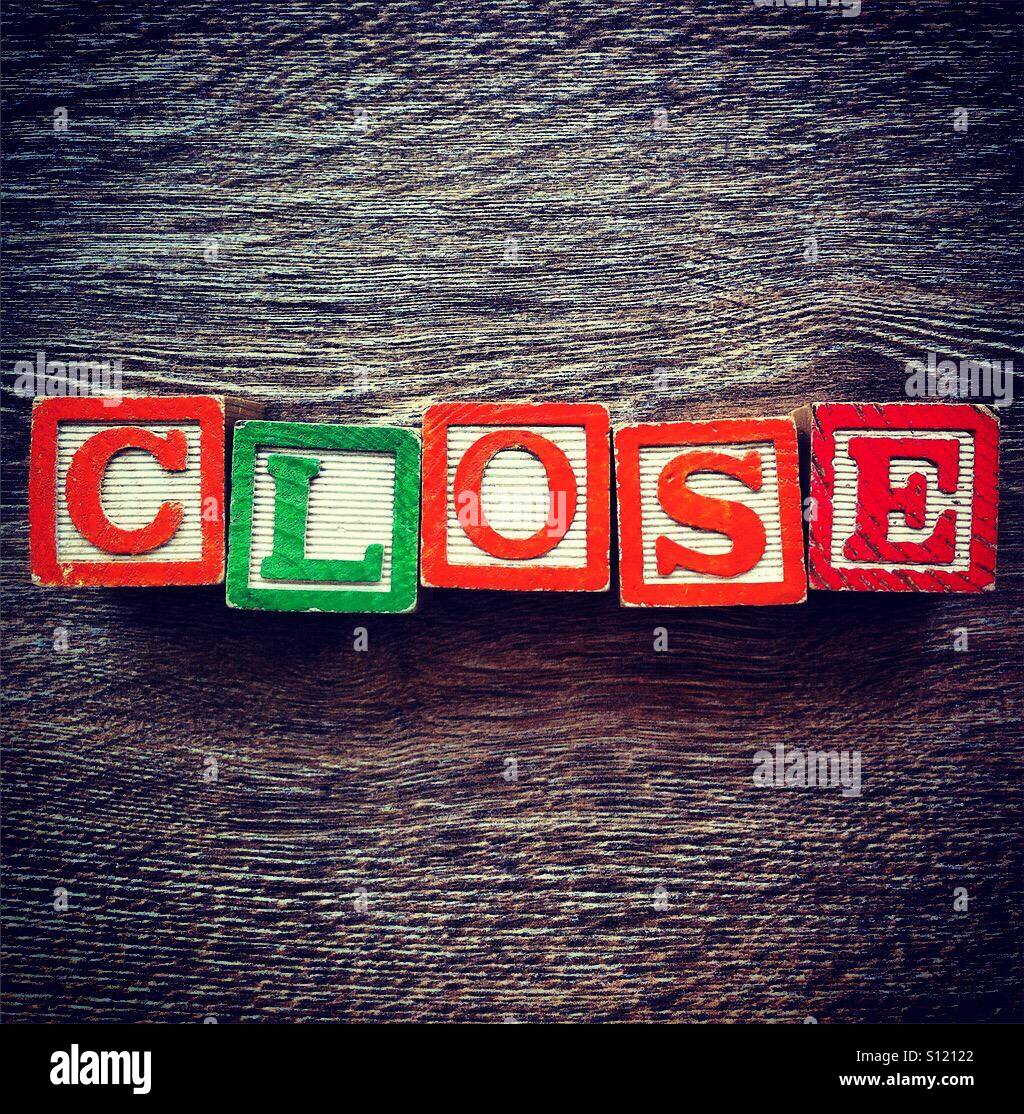CLOSE word done with alphabet wood blocks letters Stock Photo - Alamy