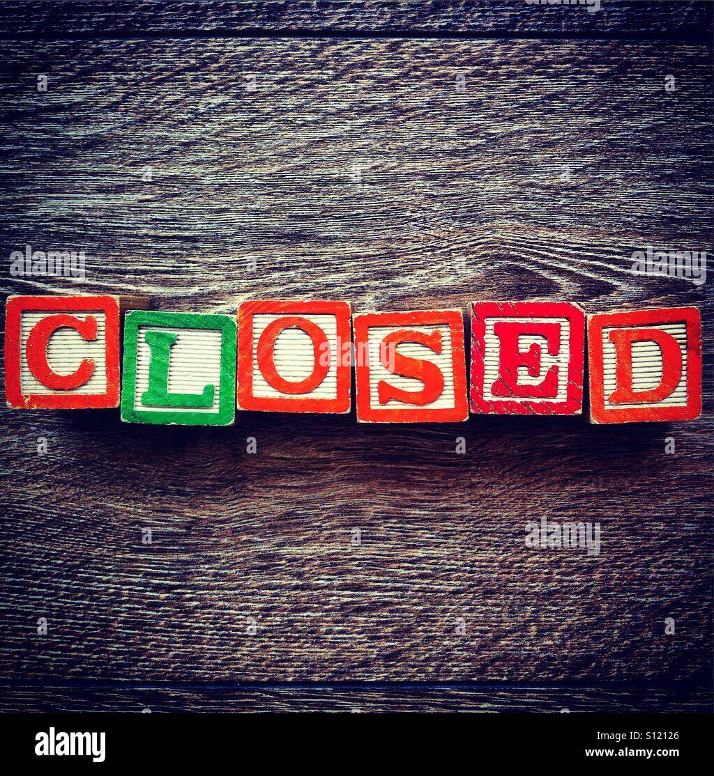 CLOSED word done with alphabet wood blocks letters Stock Photo - Alamy