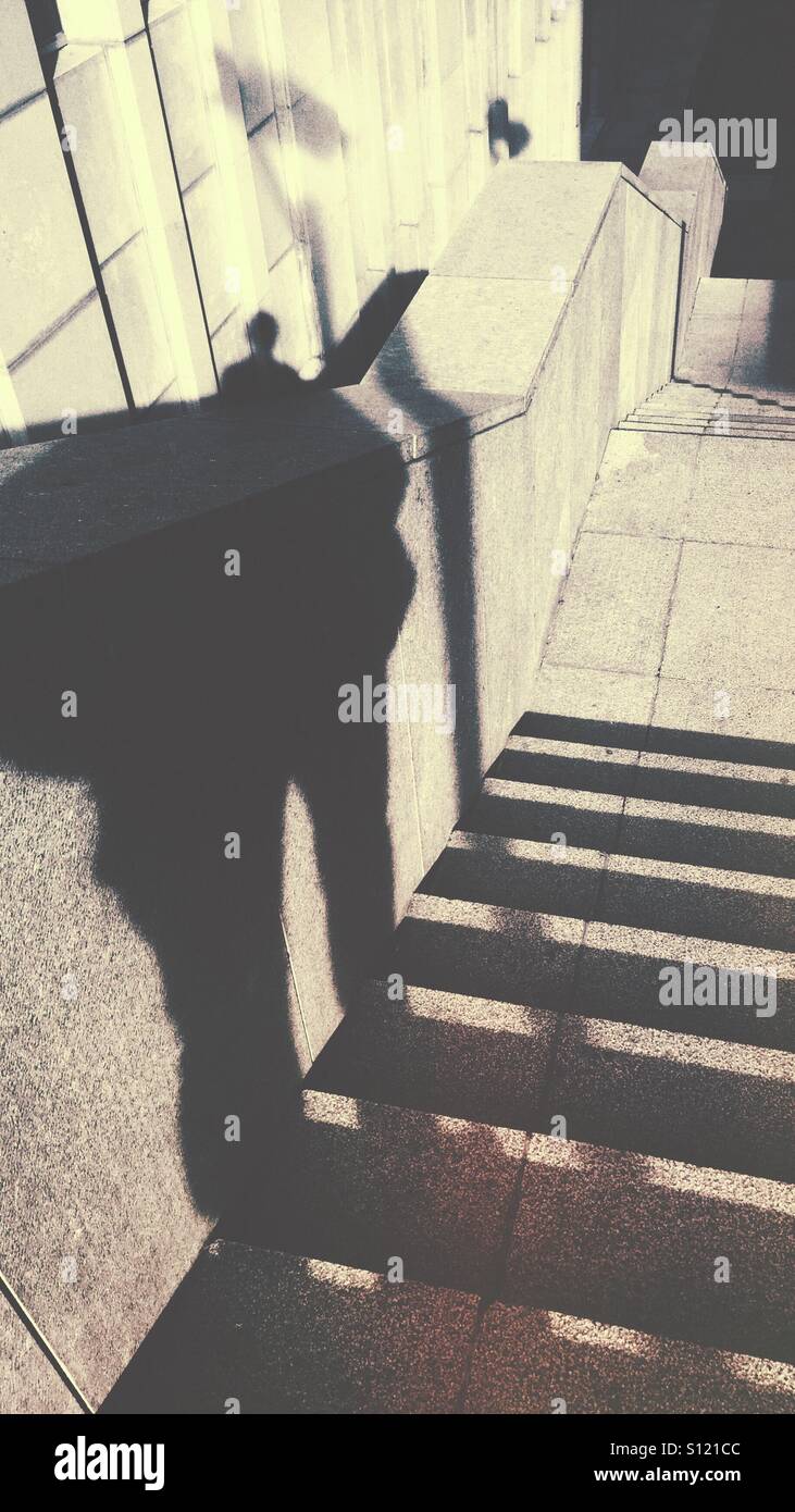 Broken shadow of a man Stock Photo - Alamy