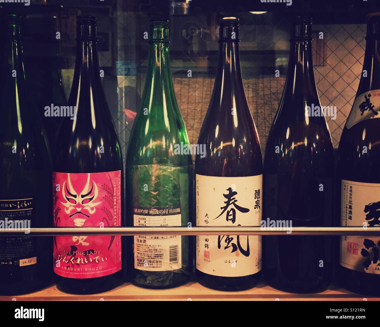 Sake bottles in a row Stock Photo - Alamy