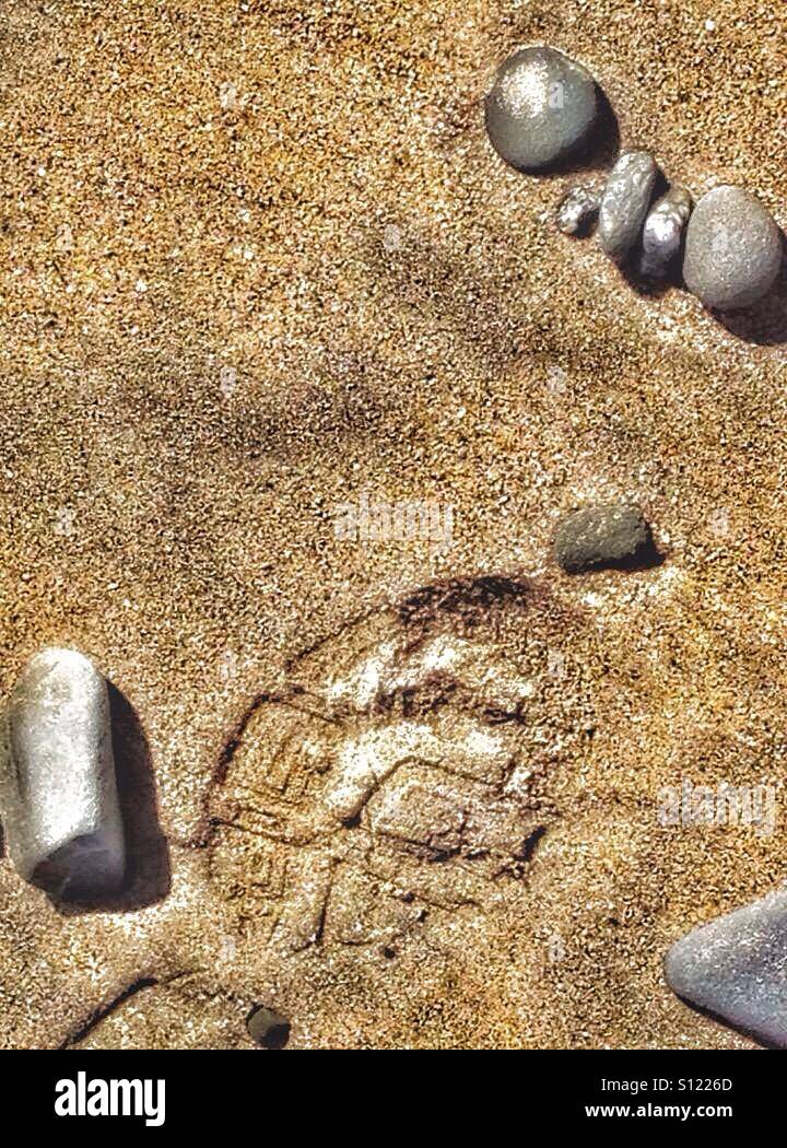Boot prints in the sand Stock Photo - Alamy