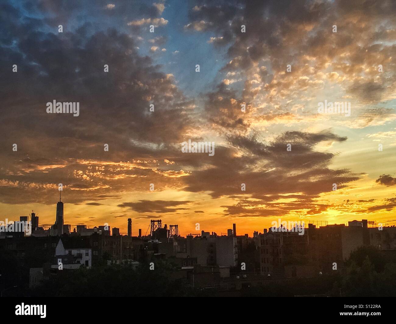 NYC sunset from a window in Williamsburg, Brooklyn Stock Photo - Alamy
