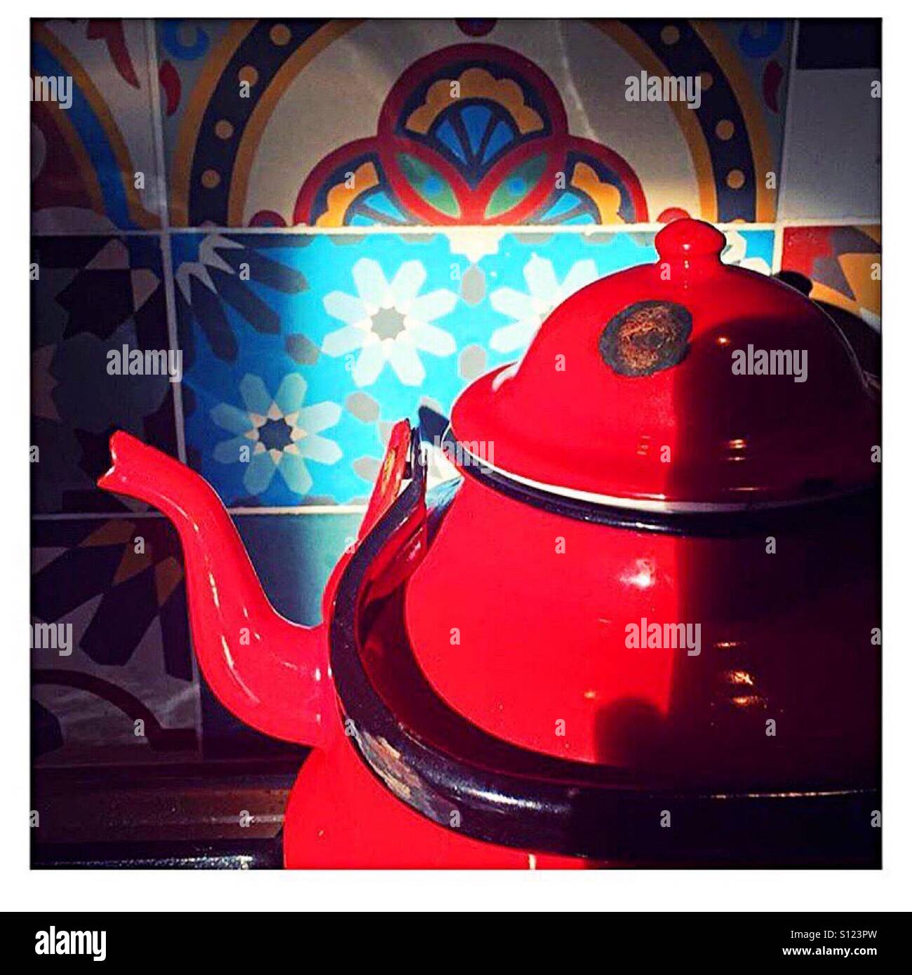 Red enamel kettle Stock Photo - Alamy