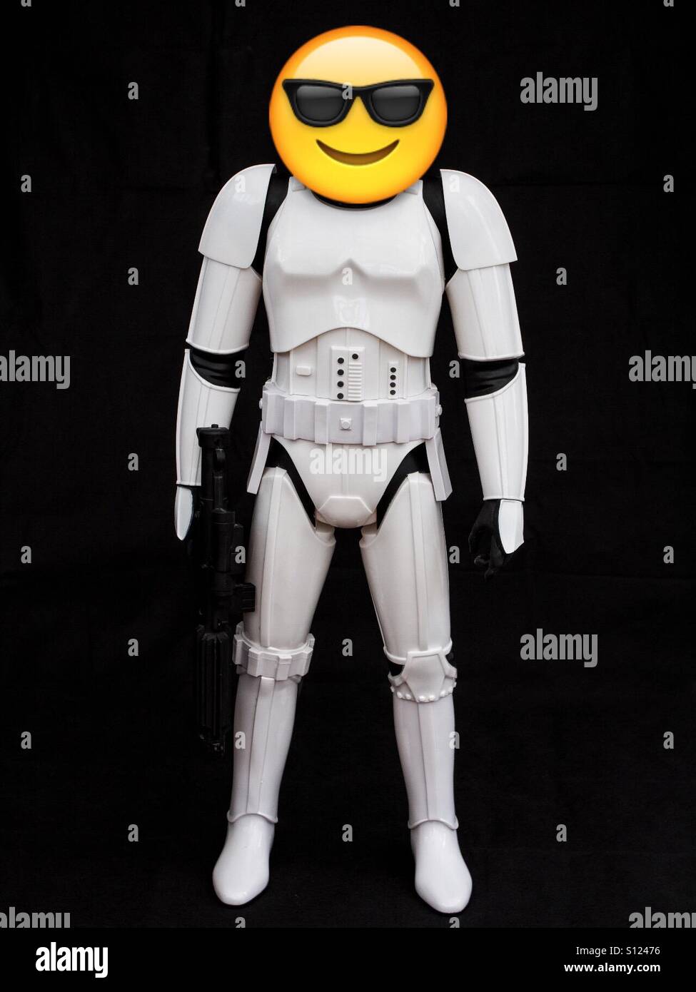 A Star Wars Stormtrooper with a smiling emoji and sunglasses Stock ...