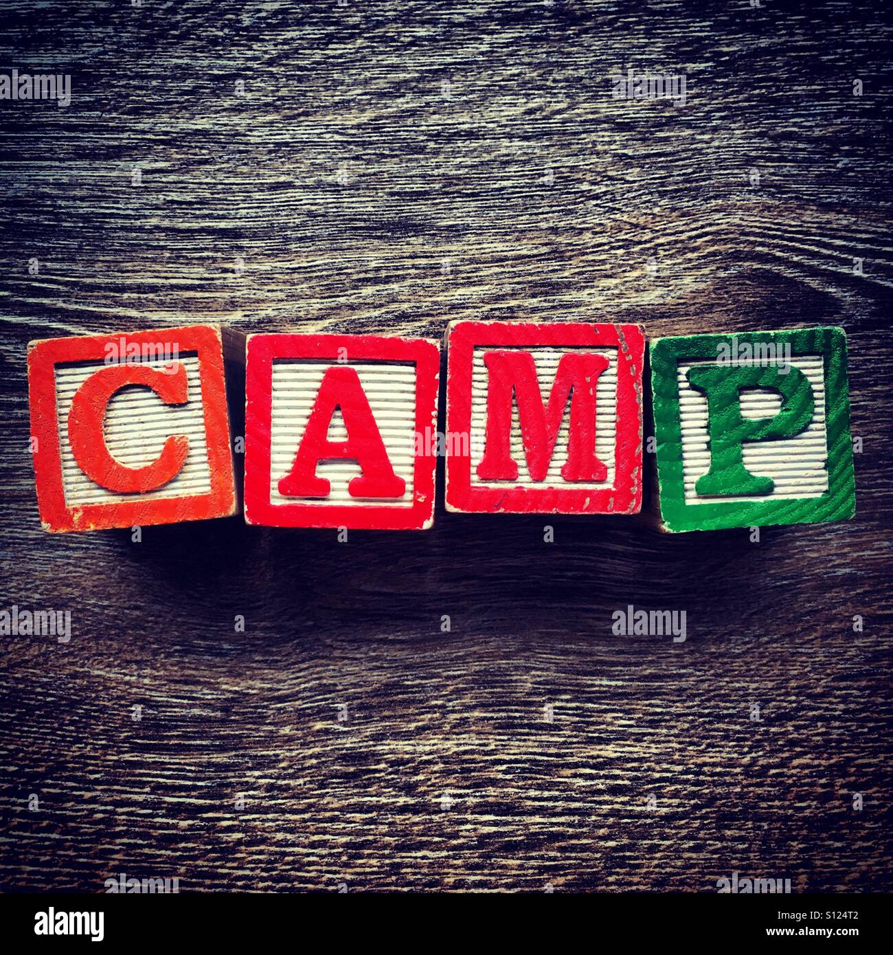 CAMP word written with wood block number toys Stock Photo - Alamy