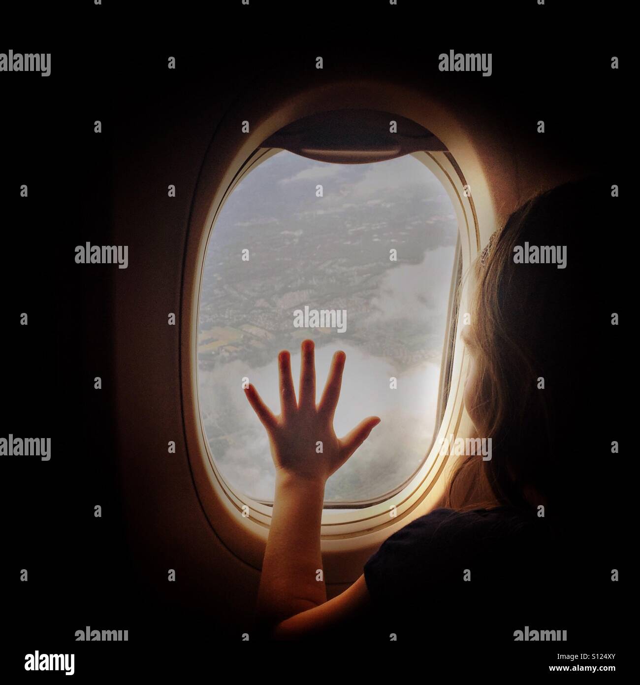 Girl looking out plane window Stock Photo - Alamy Girl looking out plane window Stock Photo - Alamy