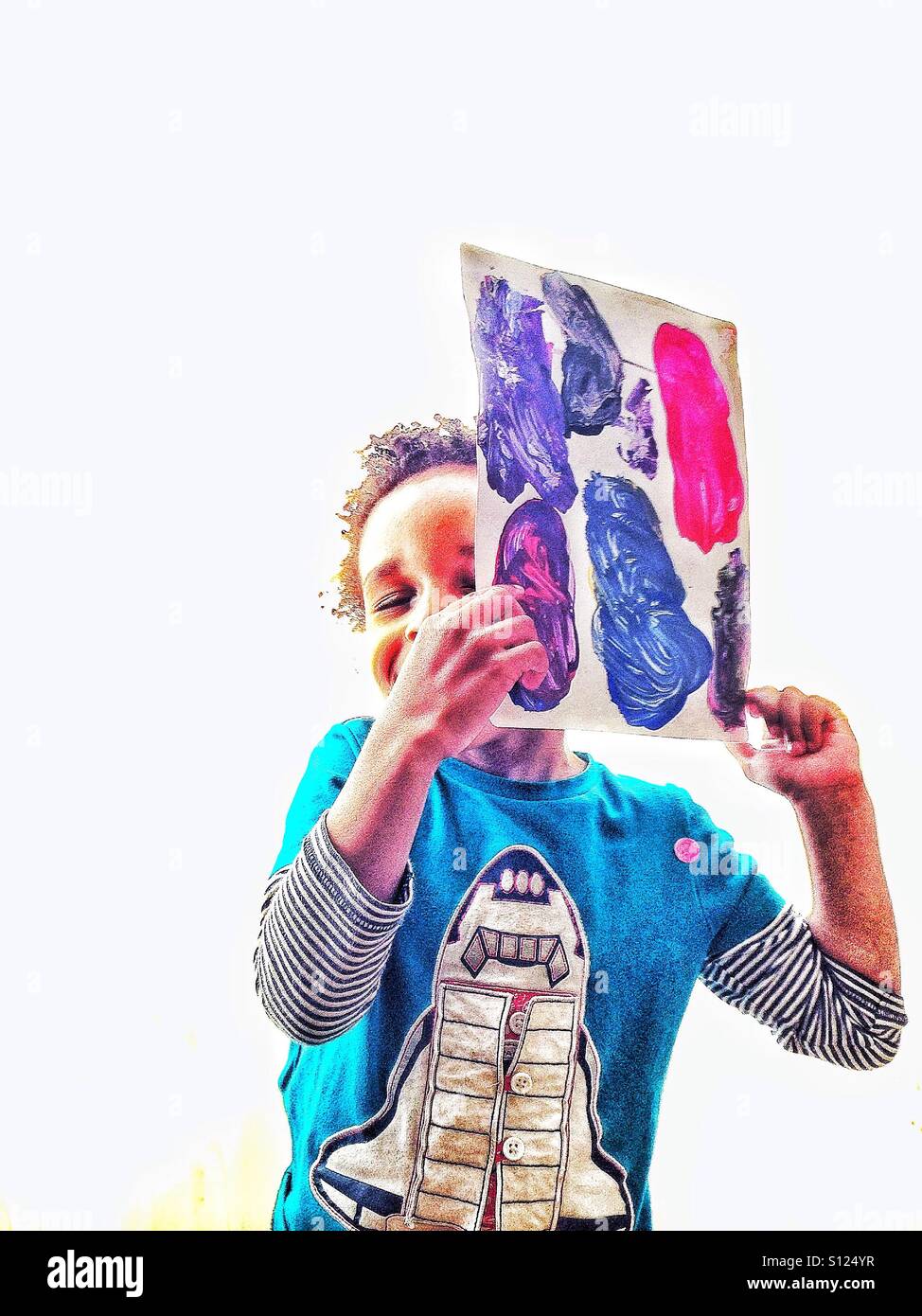A little boy shows off his artwork Stock Photo - Alamy
