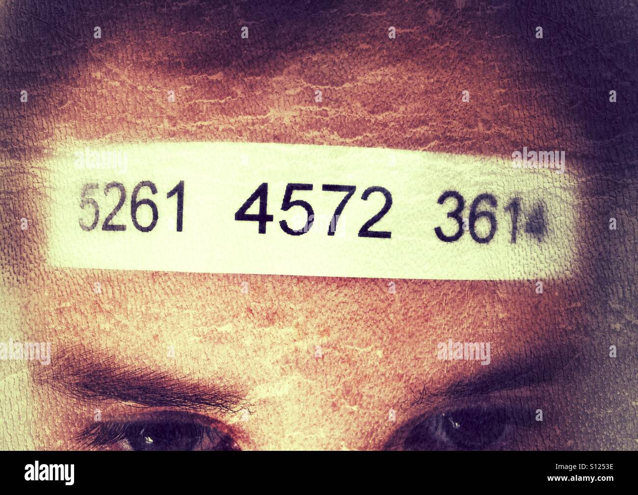 Child with security number on forehead Stock Photo - Alamy