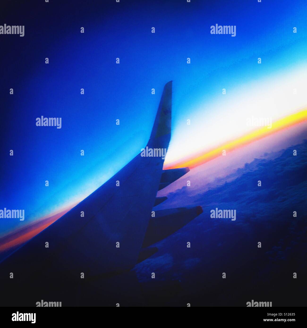Airplane at sunrise Stock Photo - Alamy