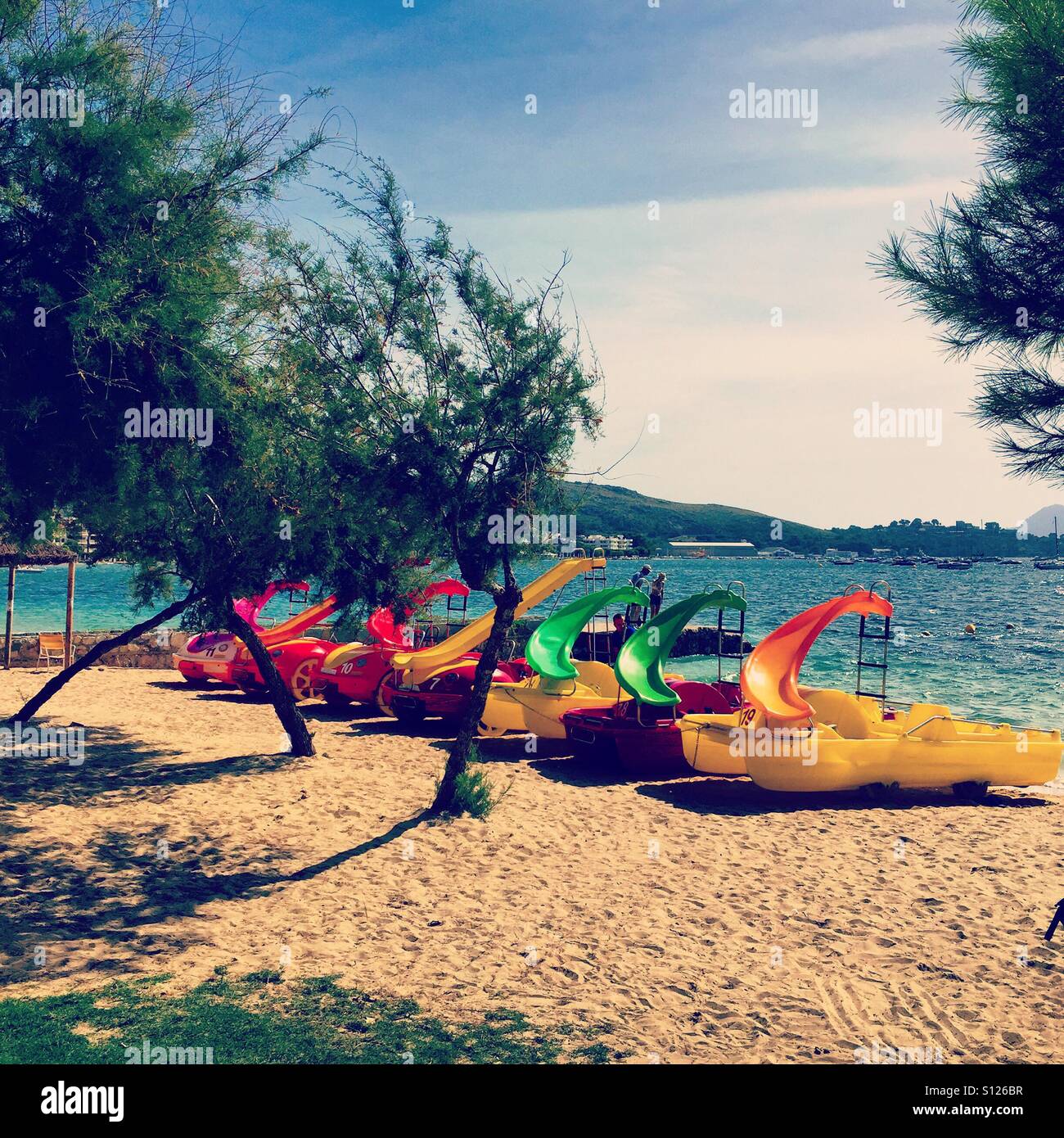 Colourful pedalo's on the beach in Puerto Pollensa, Mallorca Stock ...