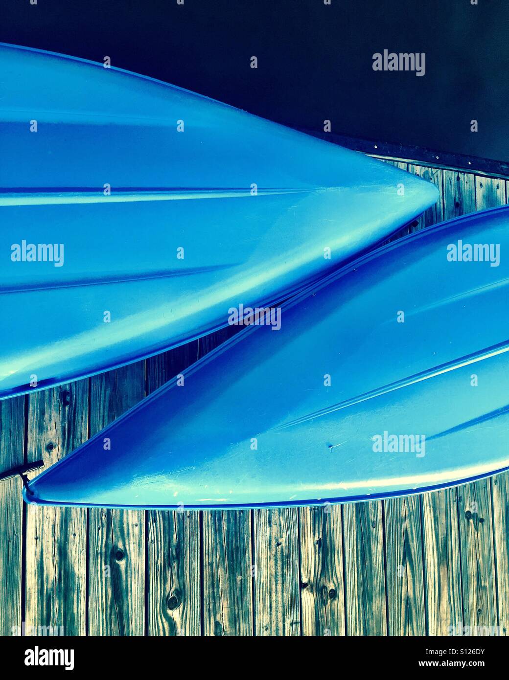 Blue canoes hi-res stock photography and images - Alamy