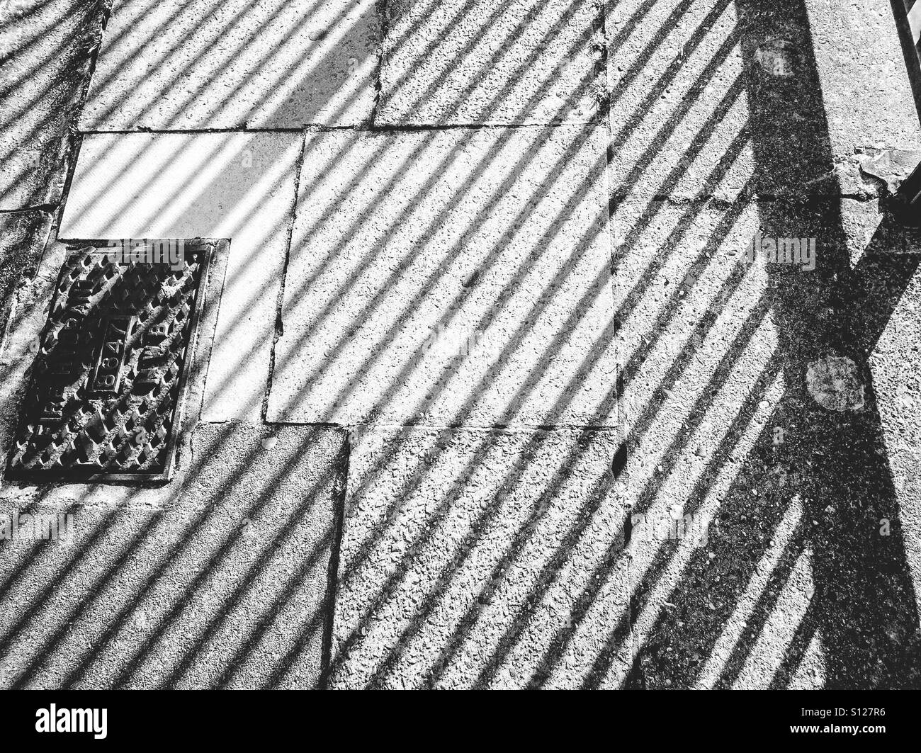 Shadows on concrete path Stock Photo - Alamy