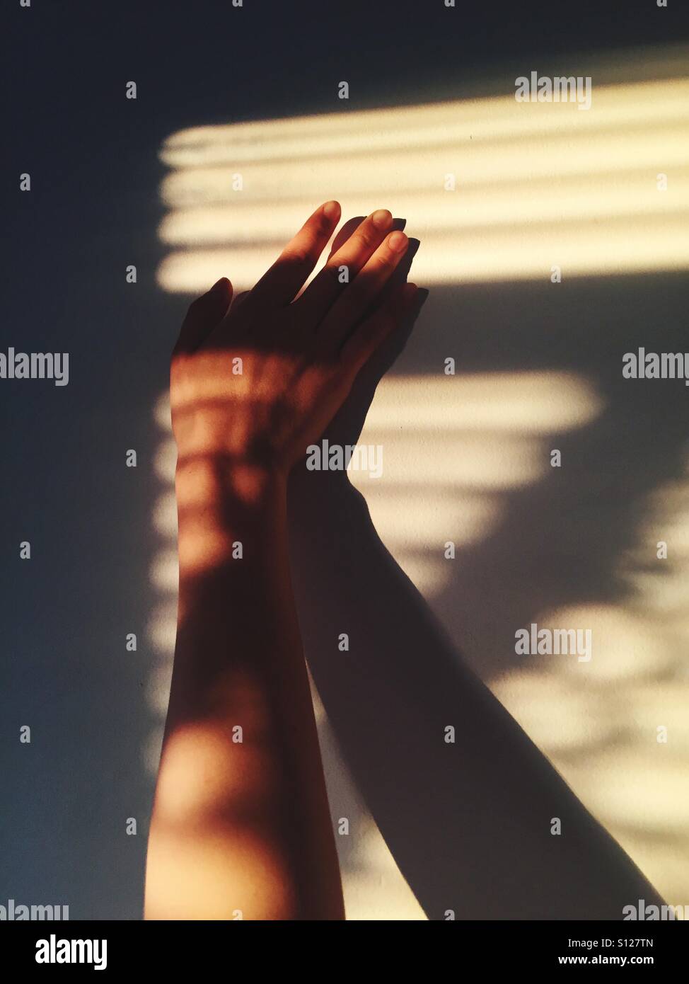 Hand against the wall hi-res stock photography and images - Alamy