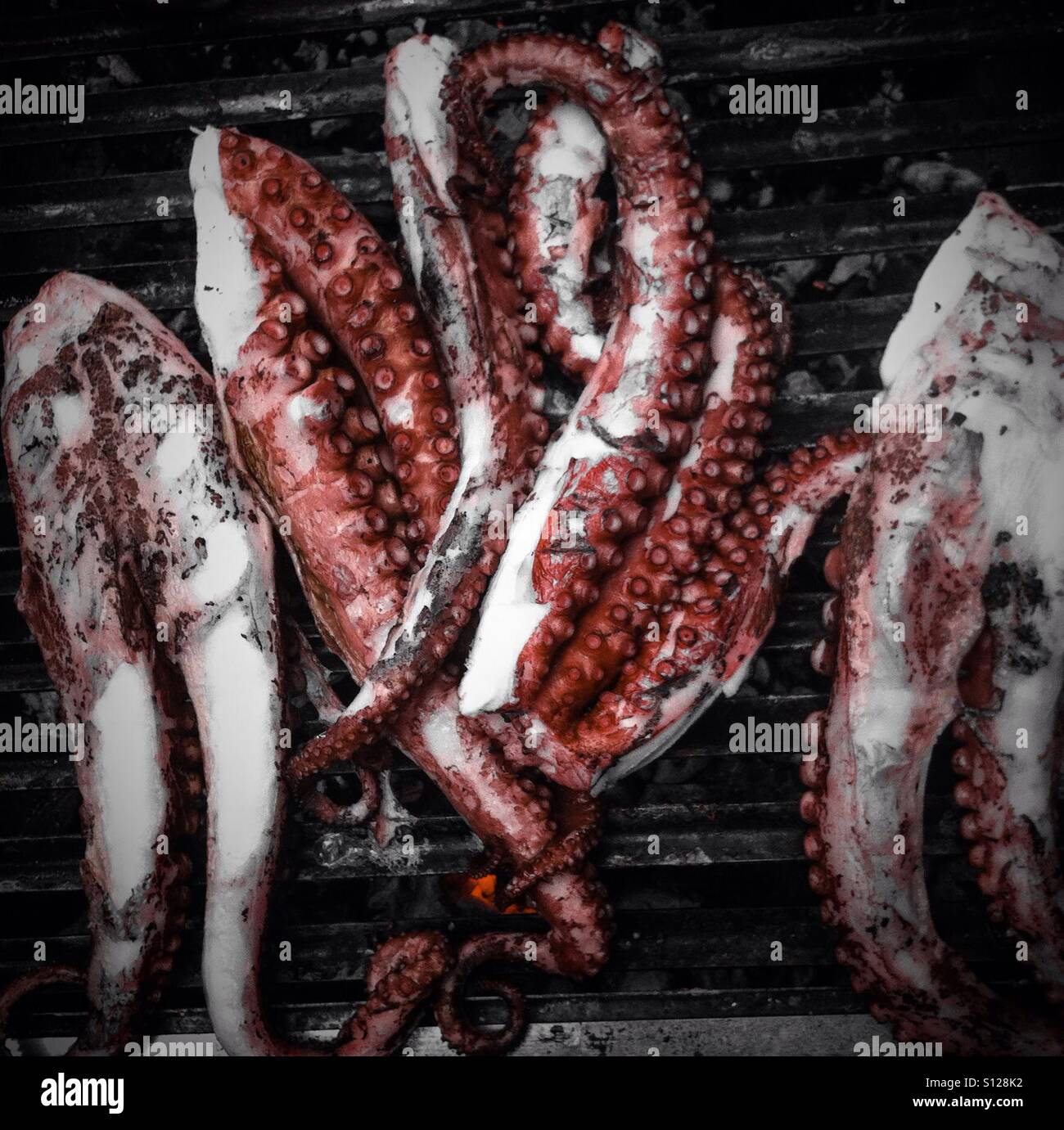 Octopus cooked on the grill Stock Photo - Alamy