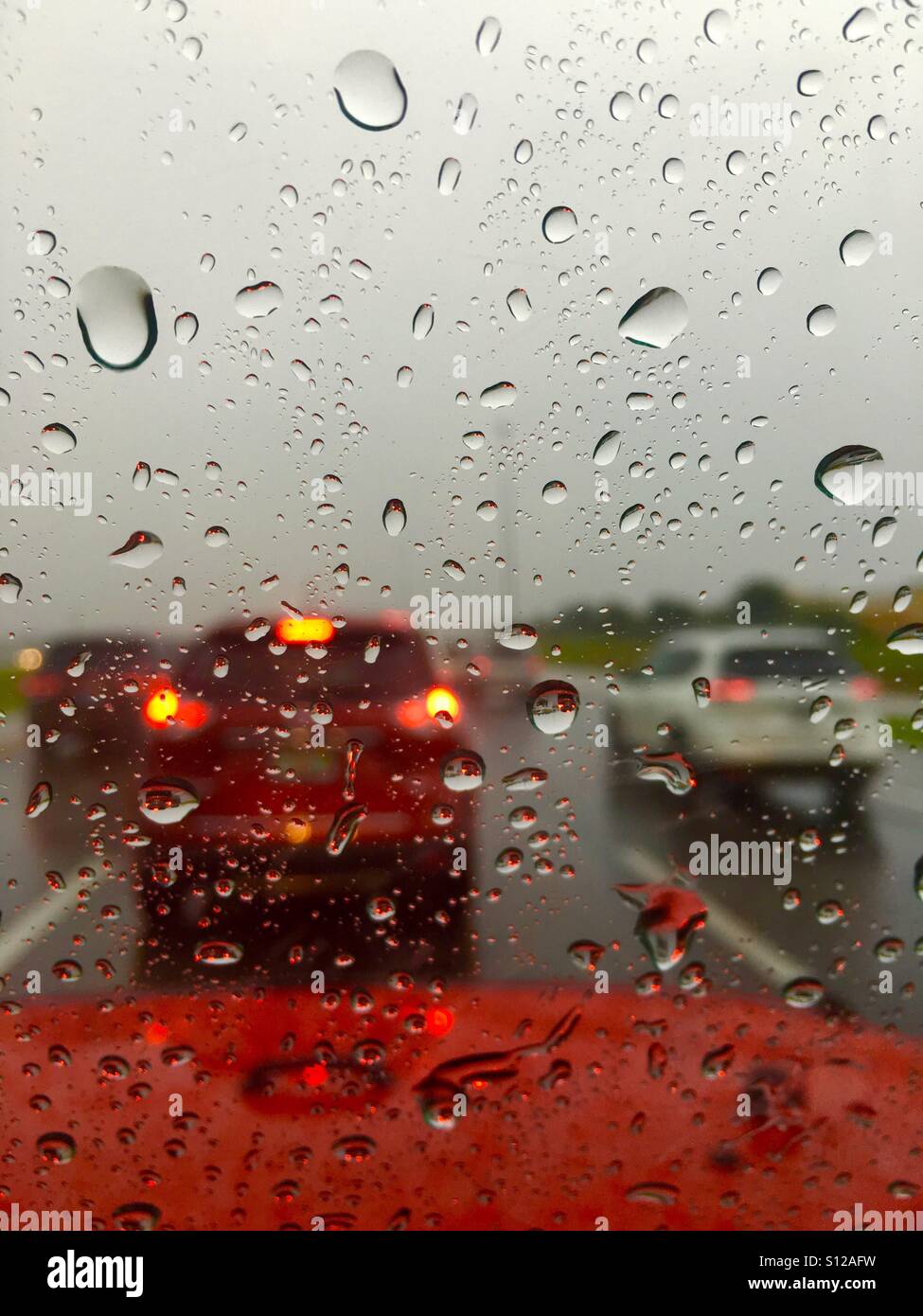 Rain storm during heavy traffic Stock Photo - Alamy