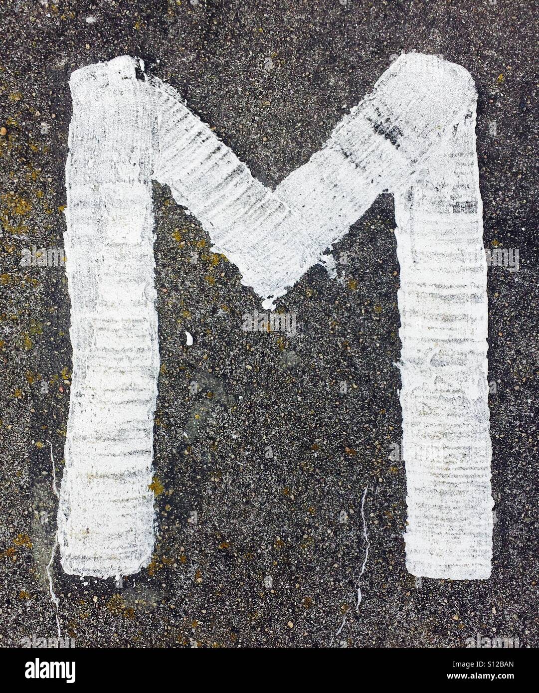 'M' road marking Stock Photo - Alamy