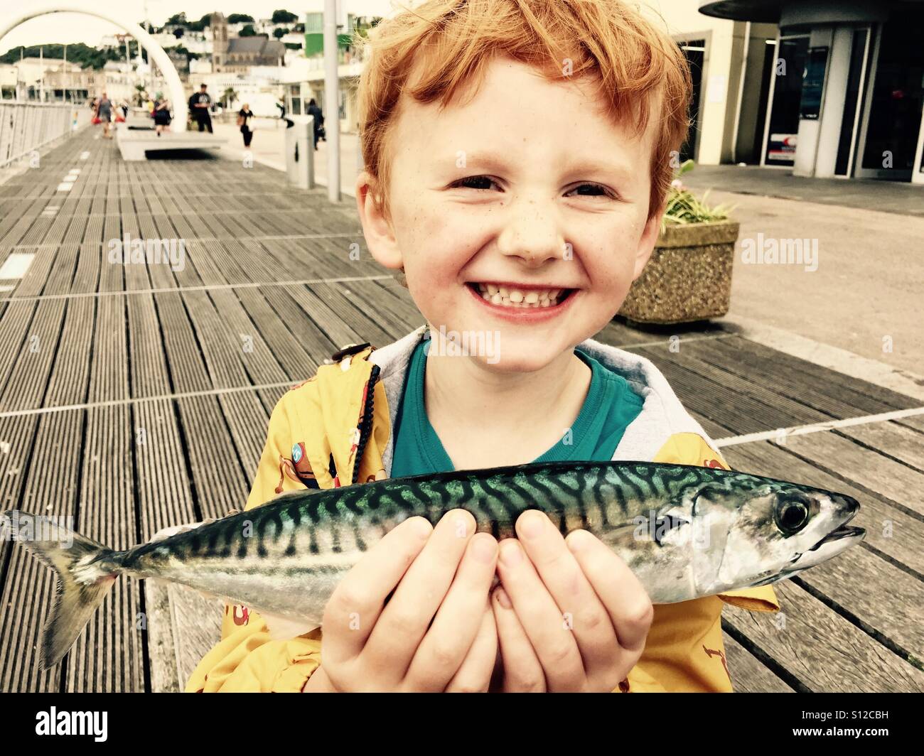 Boy Holding A Fish High Resolution Stock Photography and Images - Alamy