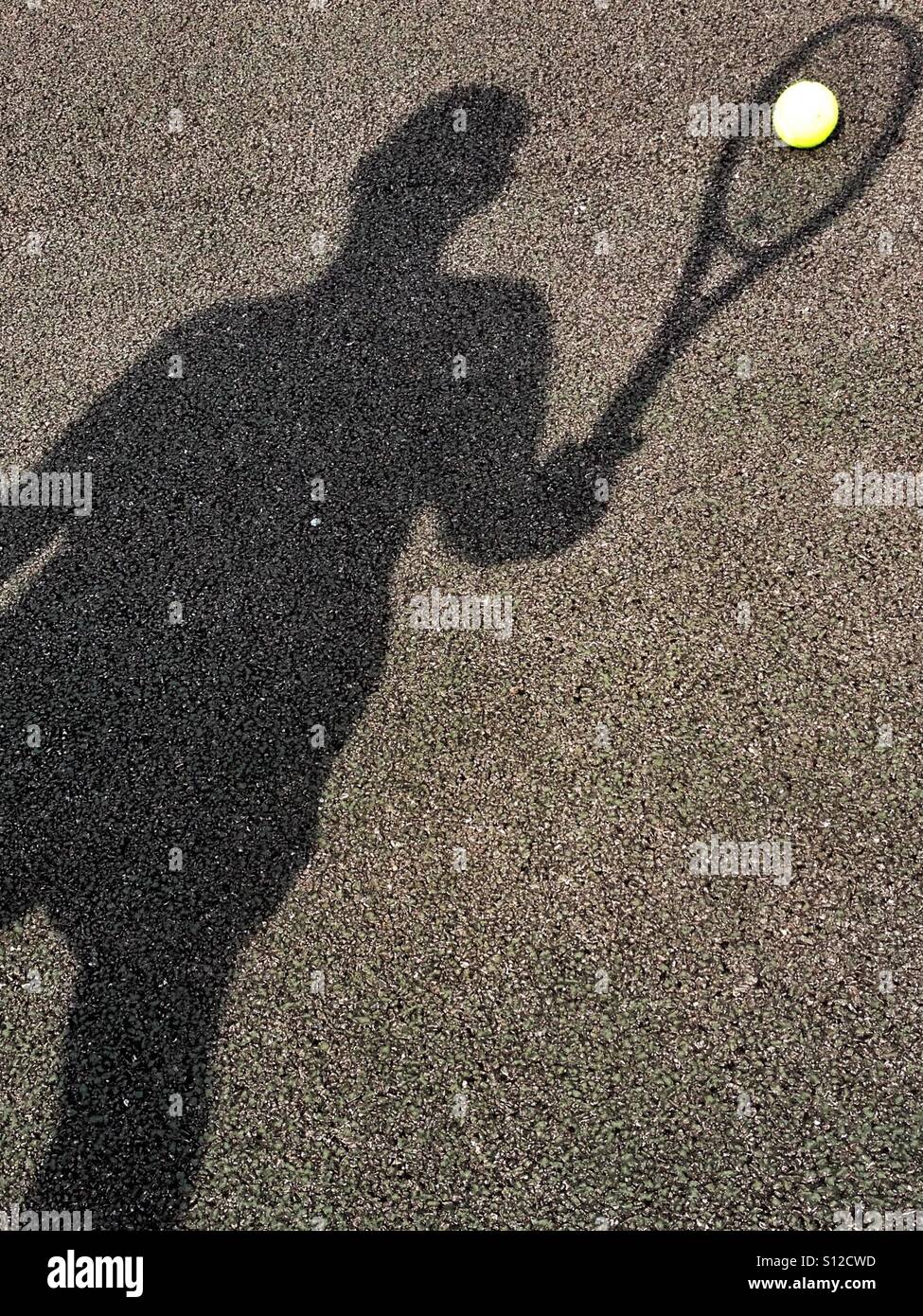 Shadow of a tennis player Stock Photo - Alamy