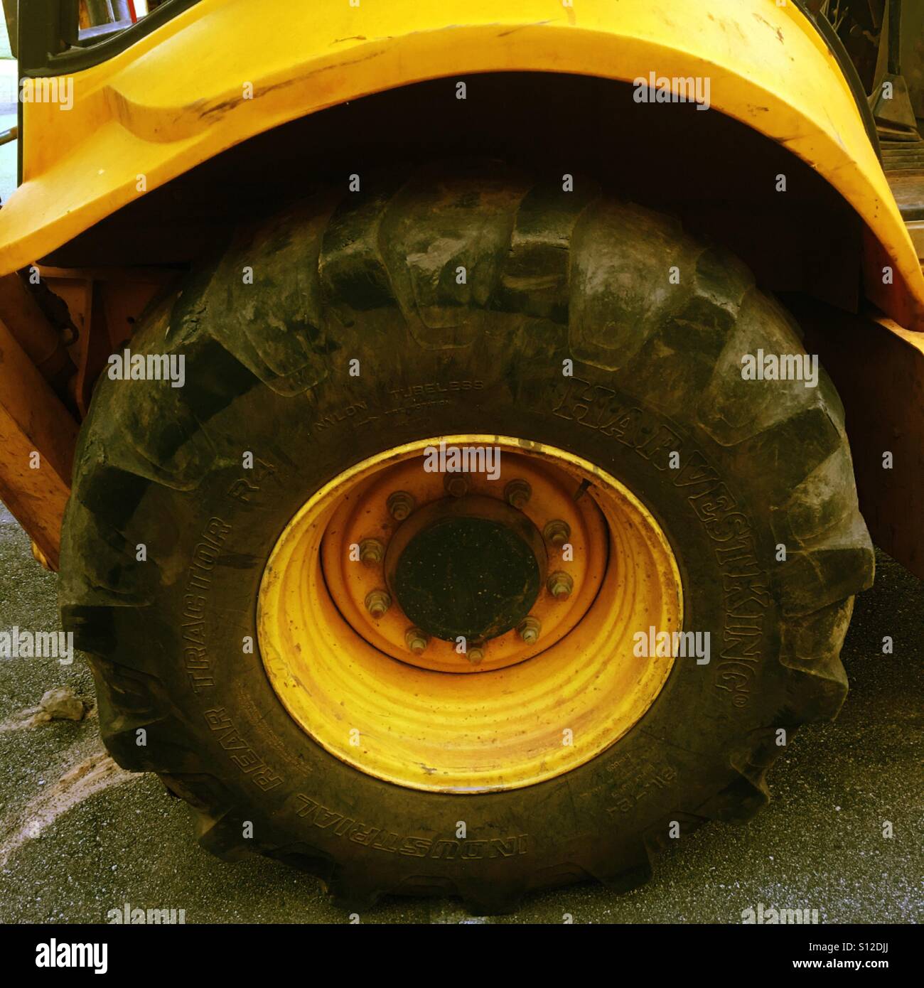 Small bulldozer wheel Stock Photo - Alamy